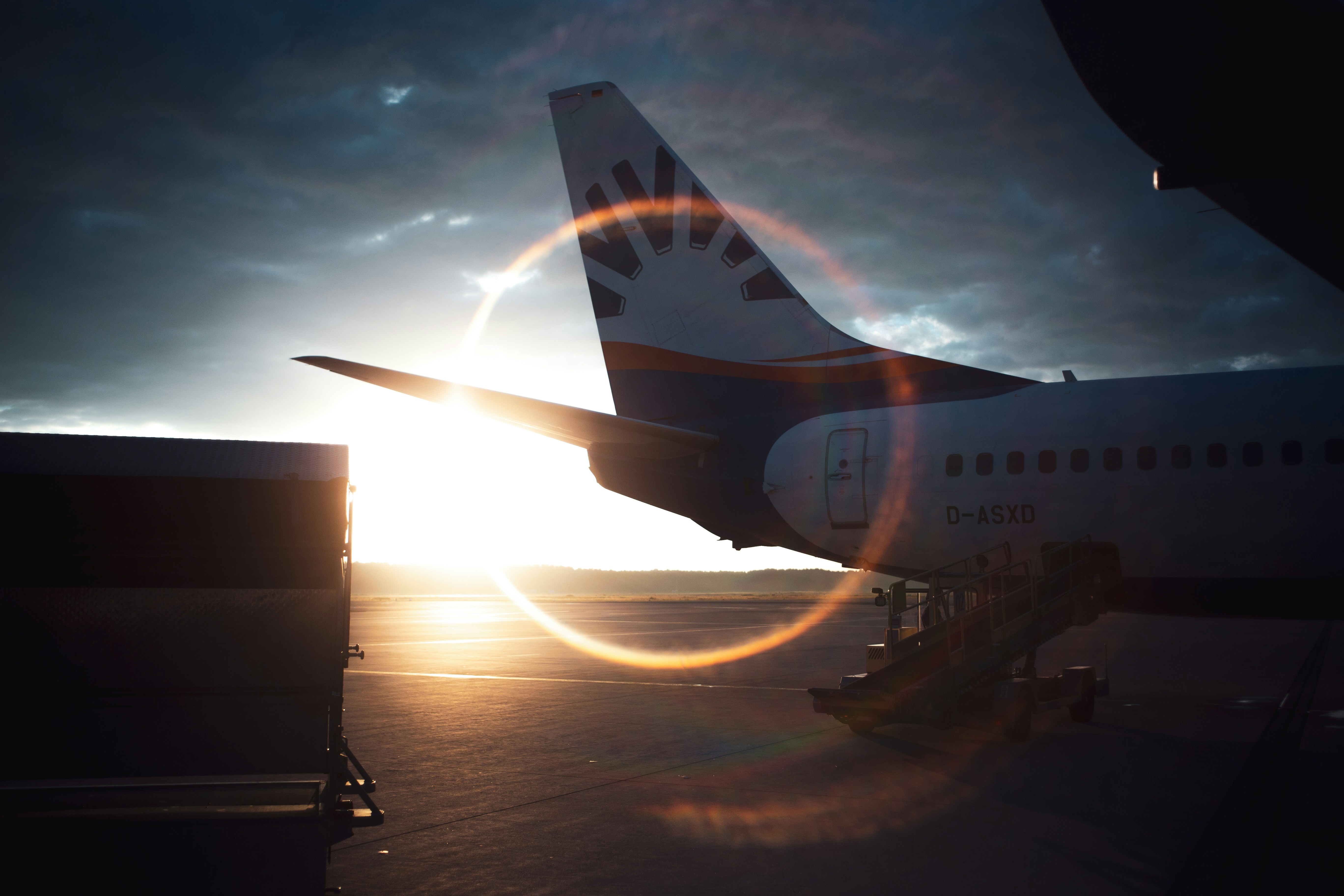 Sun Halo Over the Tail: A Sunset Gate at the Airport