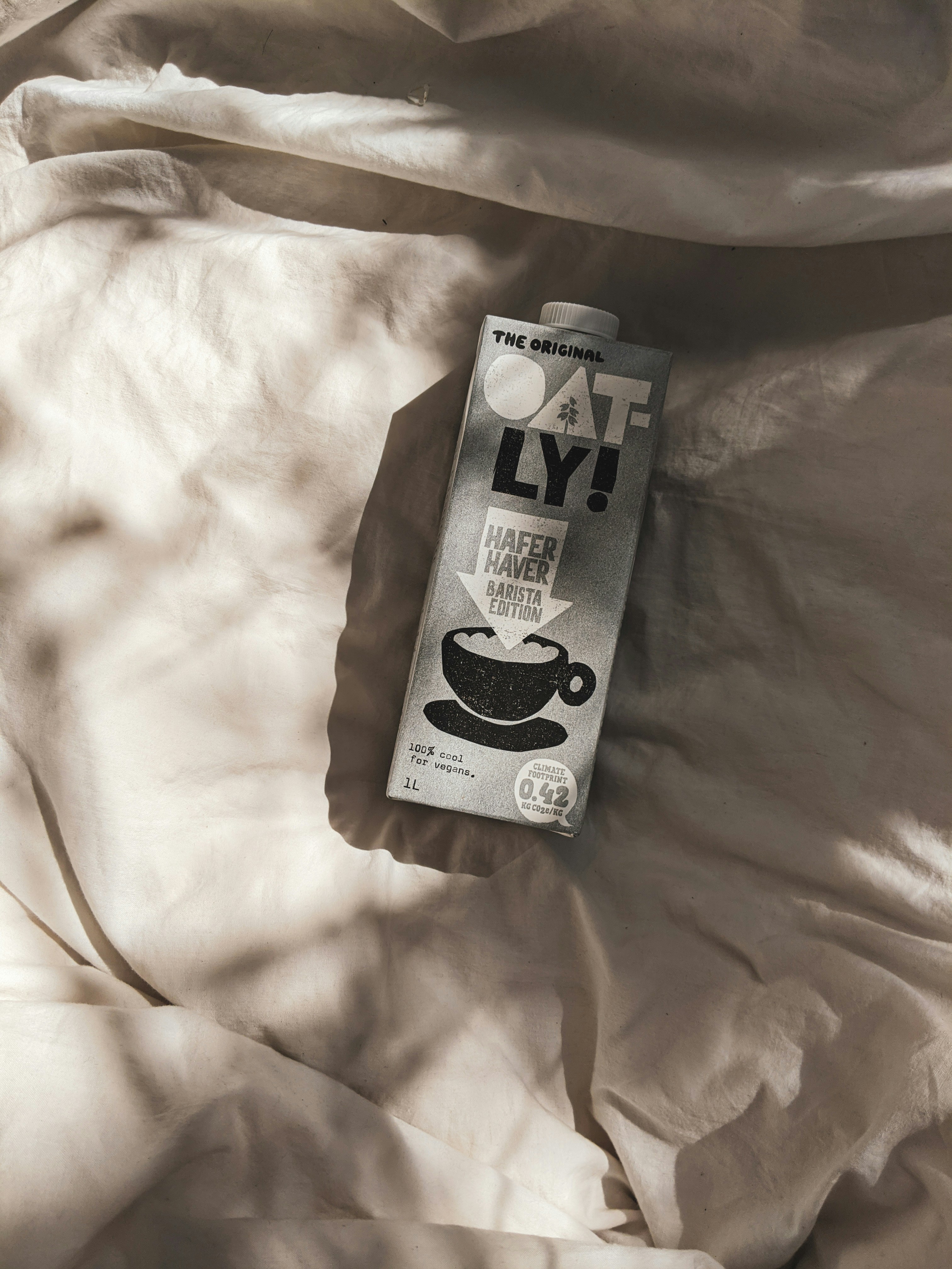Oatly Oat Milk on white background