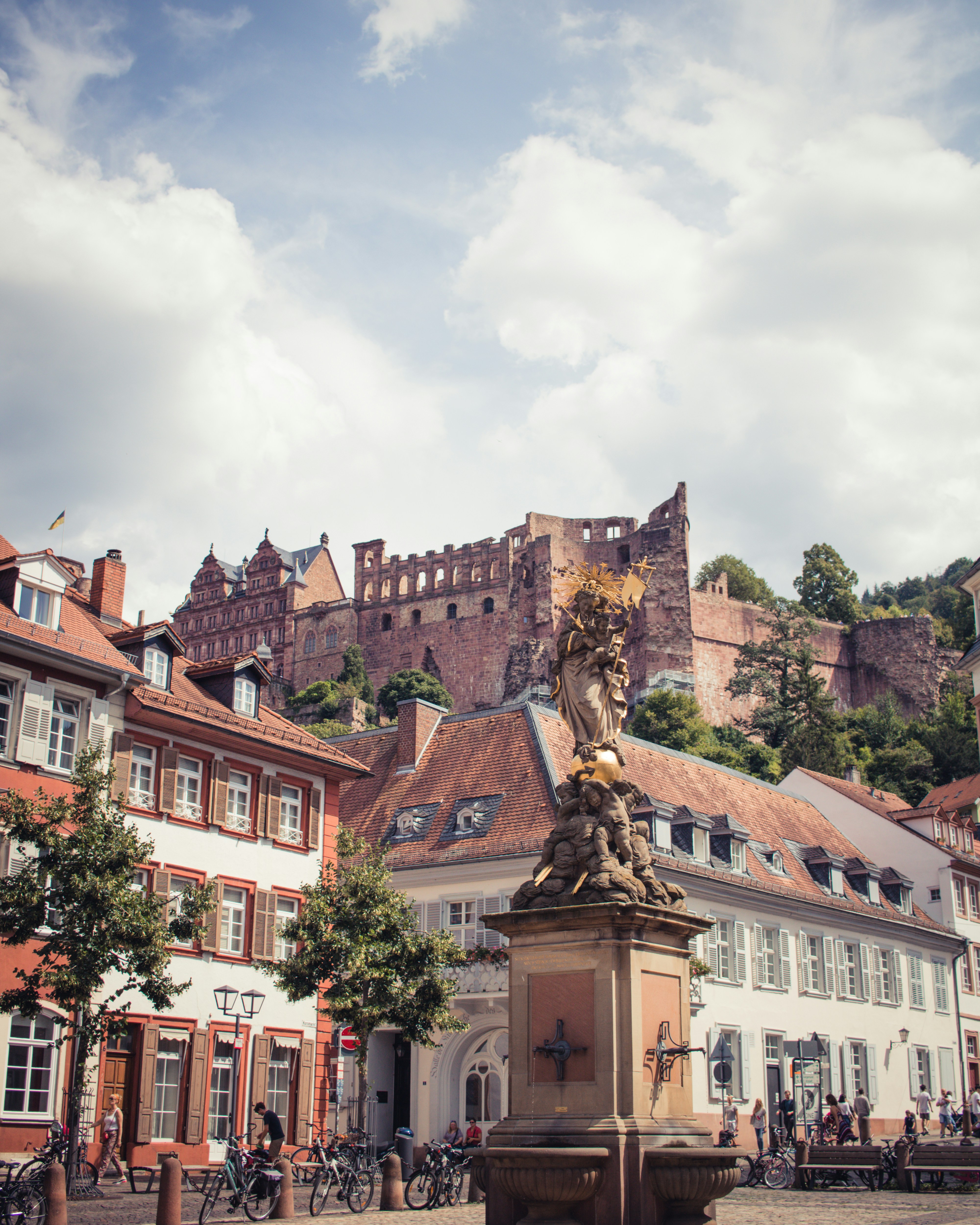 Heidelberg, Germany from the streets.  | brown and white concrete building under cloudy sky during daytime