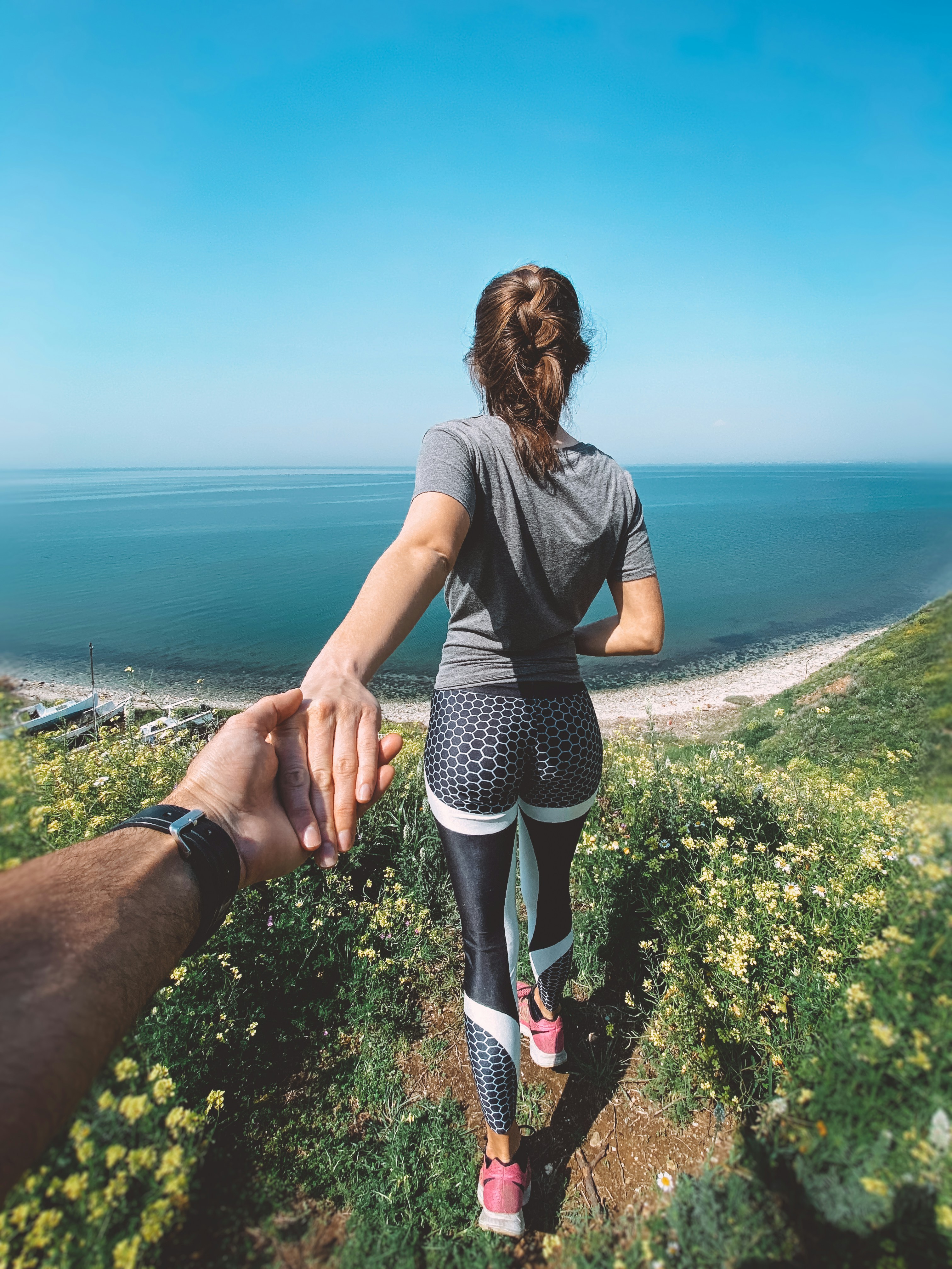 Holding Hands on a Seaside Clifftop: A Run Toward the Horizon