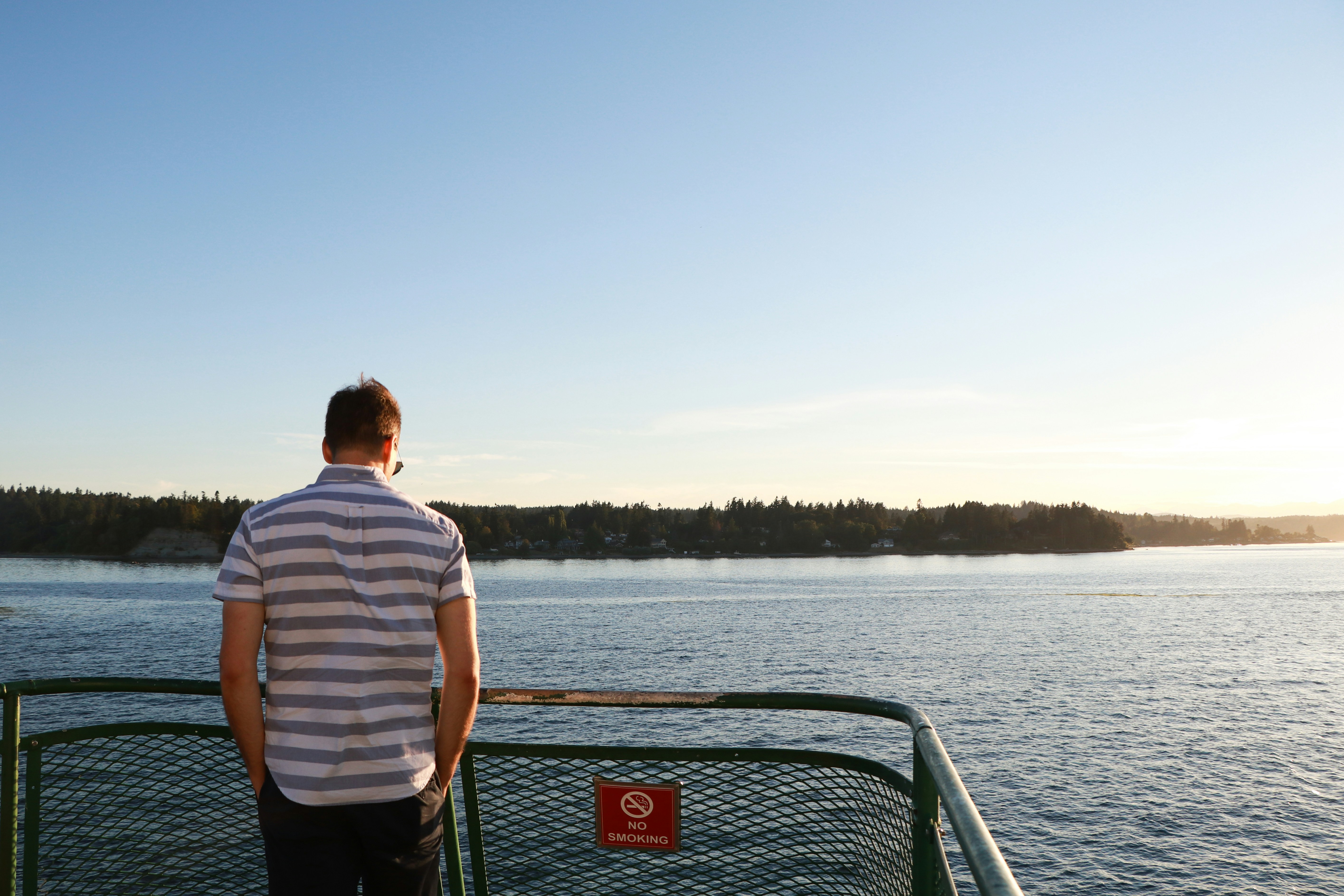 Rimmed by a Quiet Horizon: A Man Overlook on the Pier