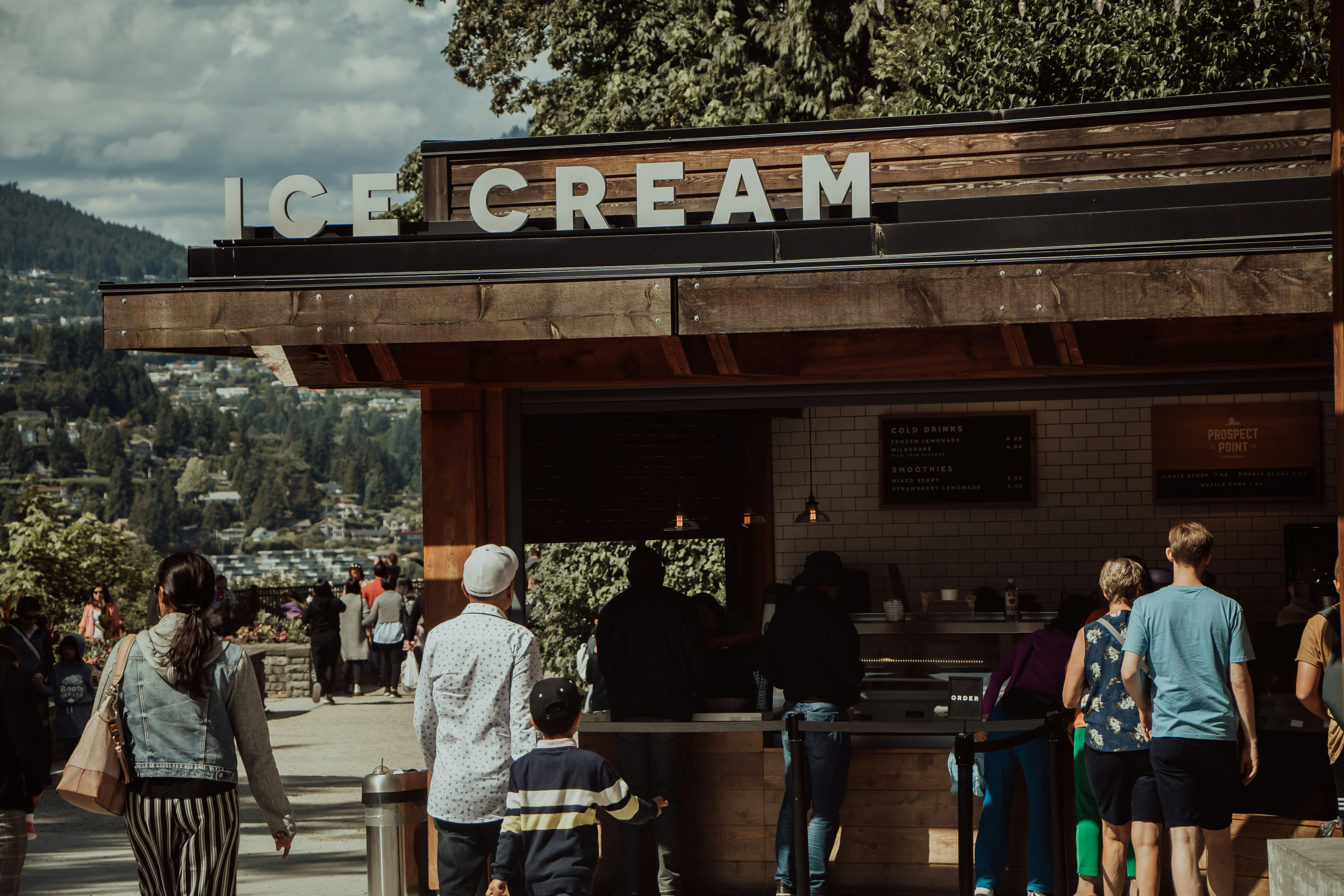 Summit Scoop: Ice-Cream Queue at a Mountain Town View