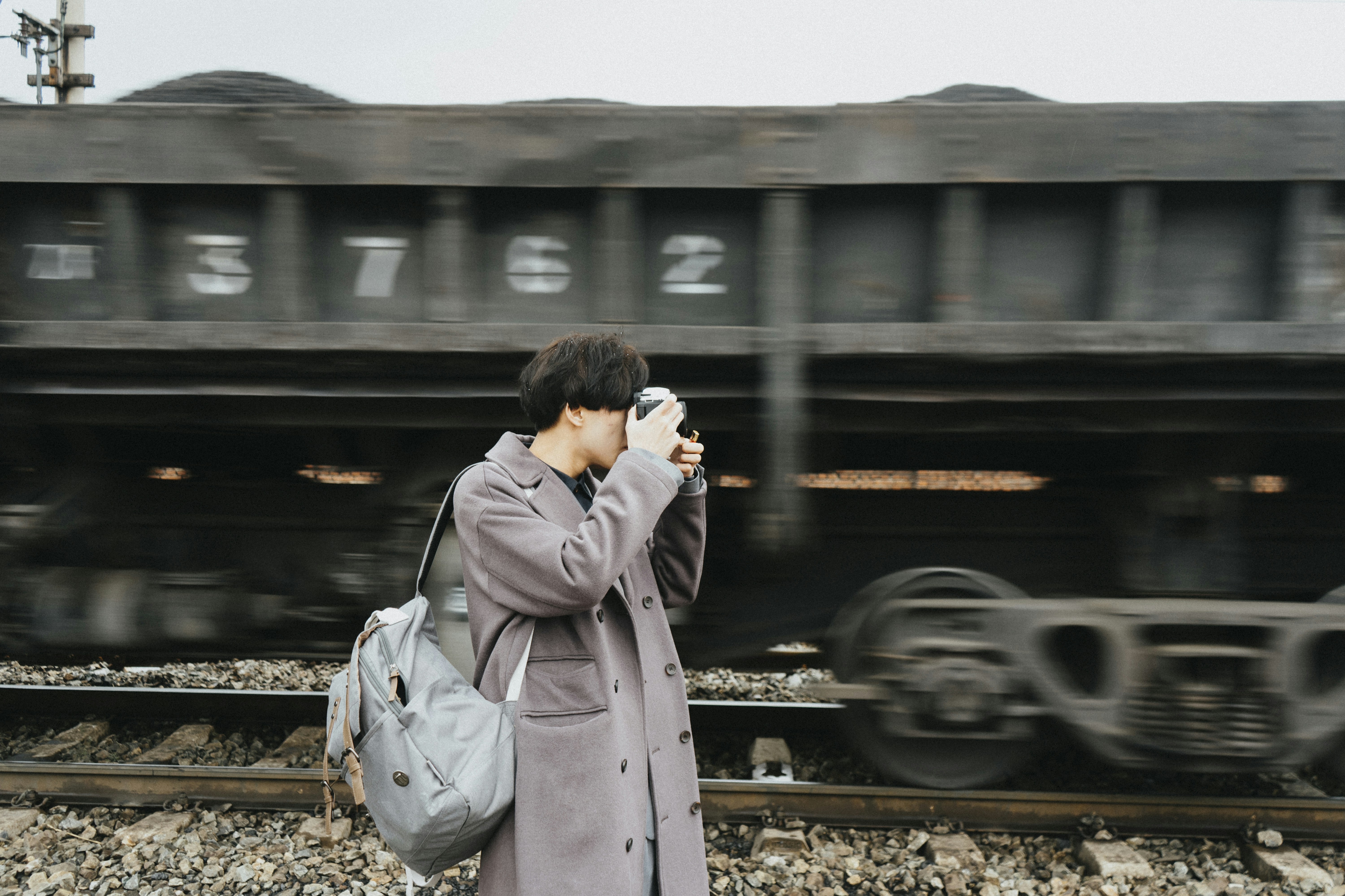 Portrait on the Rails: A photographer frames a fleeting moment beside a speeding locomotive