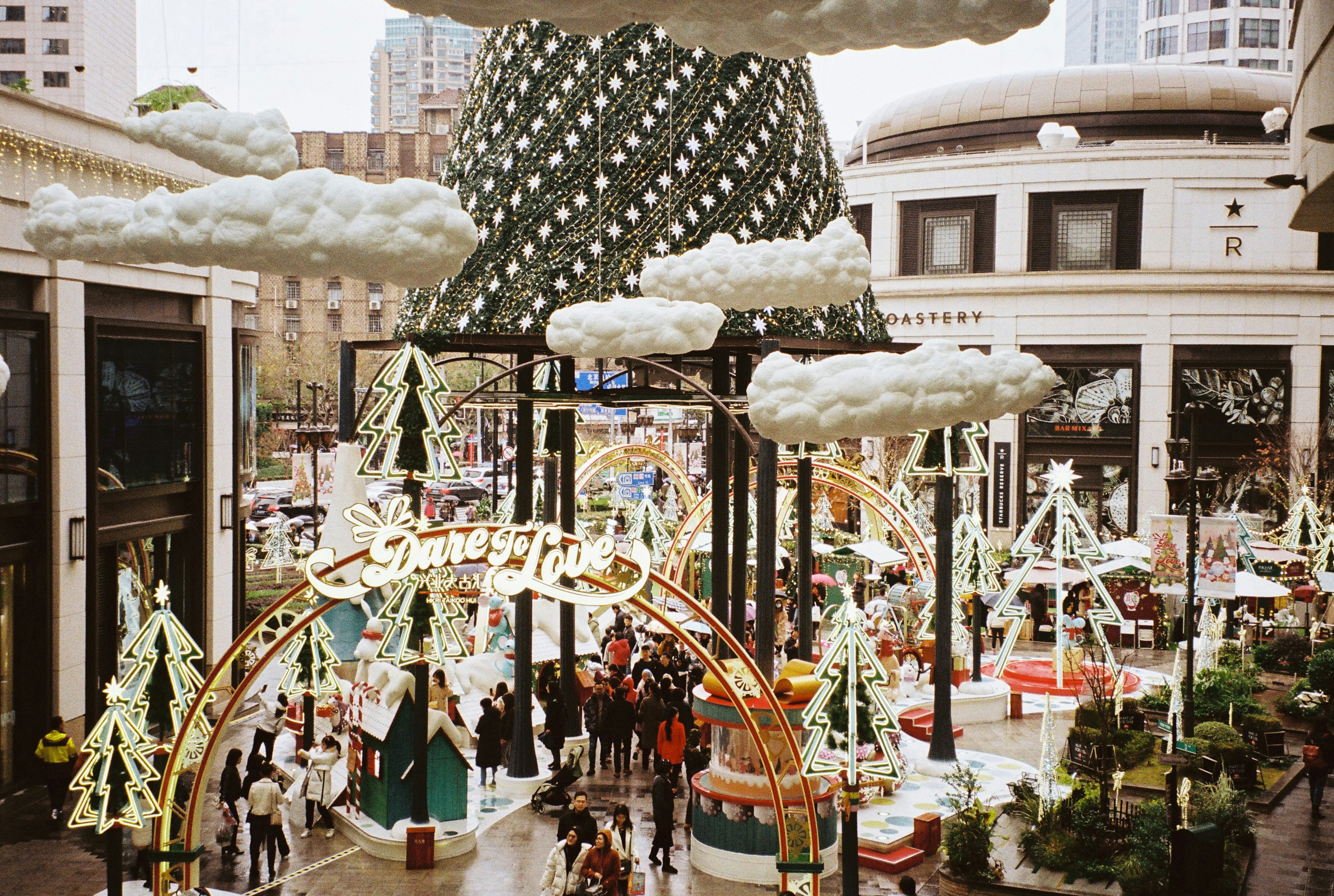 White and brown carousel near white concrete building during daytime ...