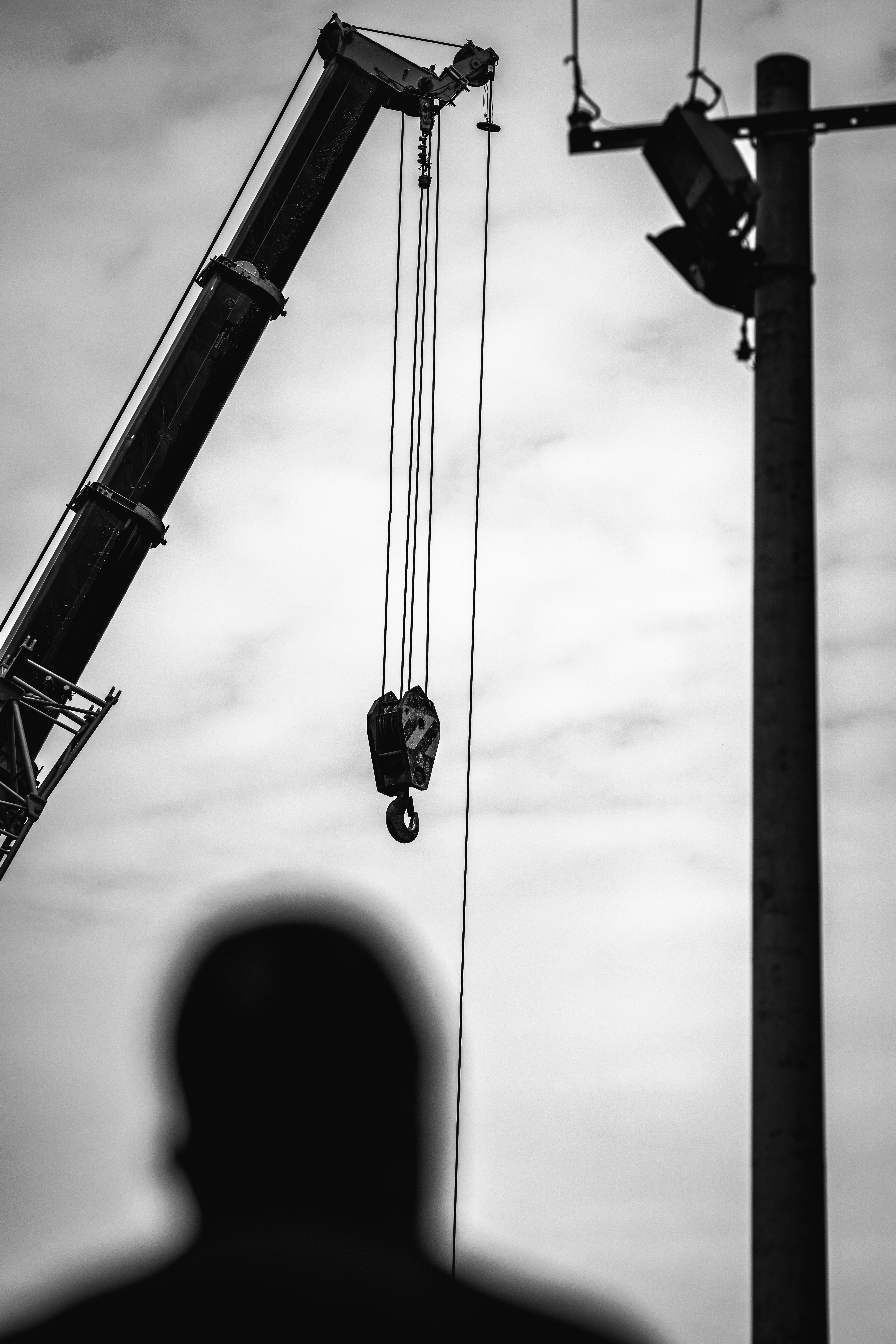 Crane Hook against Sky: A Study in Silent Construction