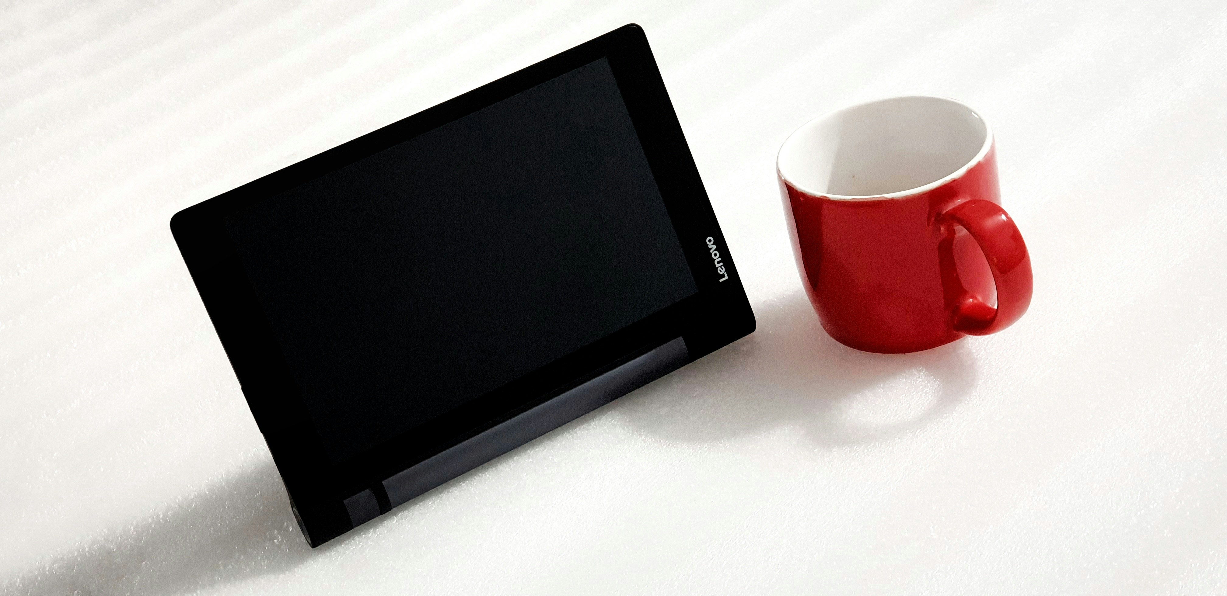 Slanted Tablet and Red Mug: Quiet Morning Still Life