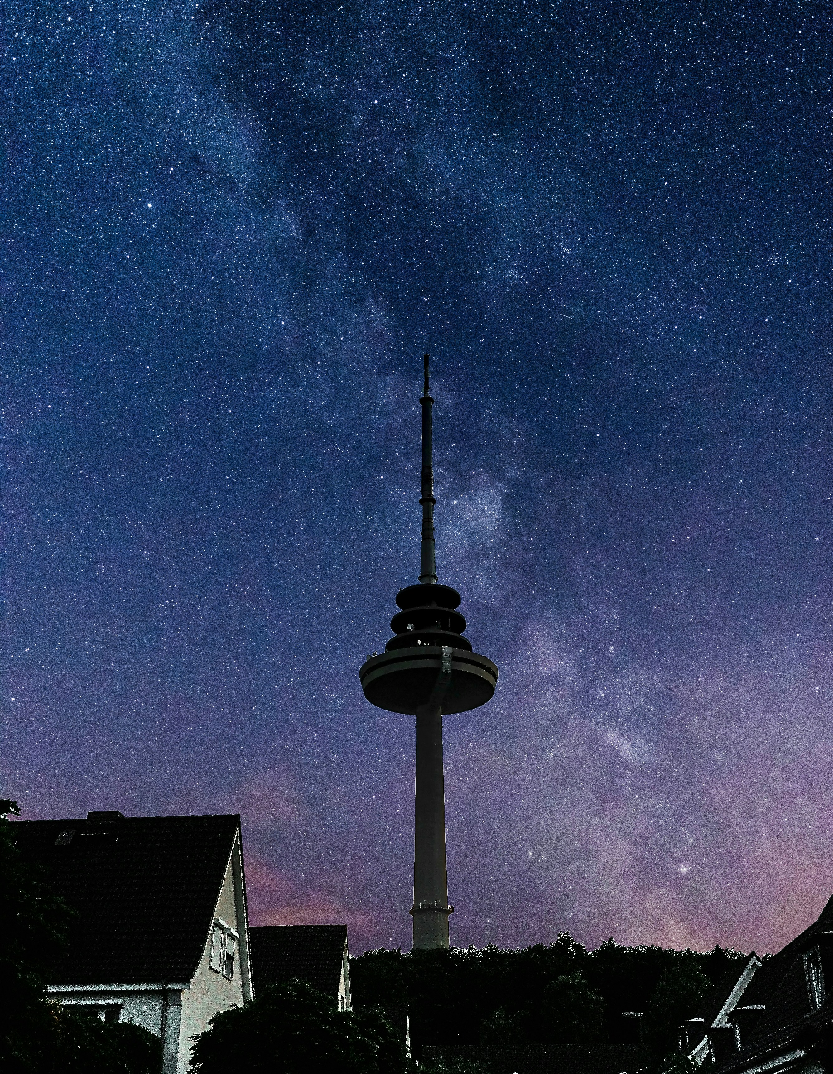 Celestial Dance Above Urban Silhouette