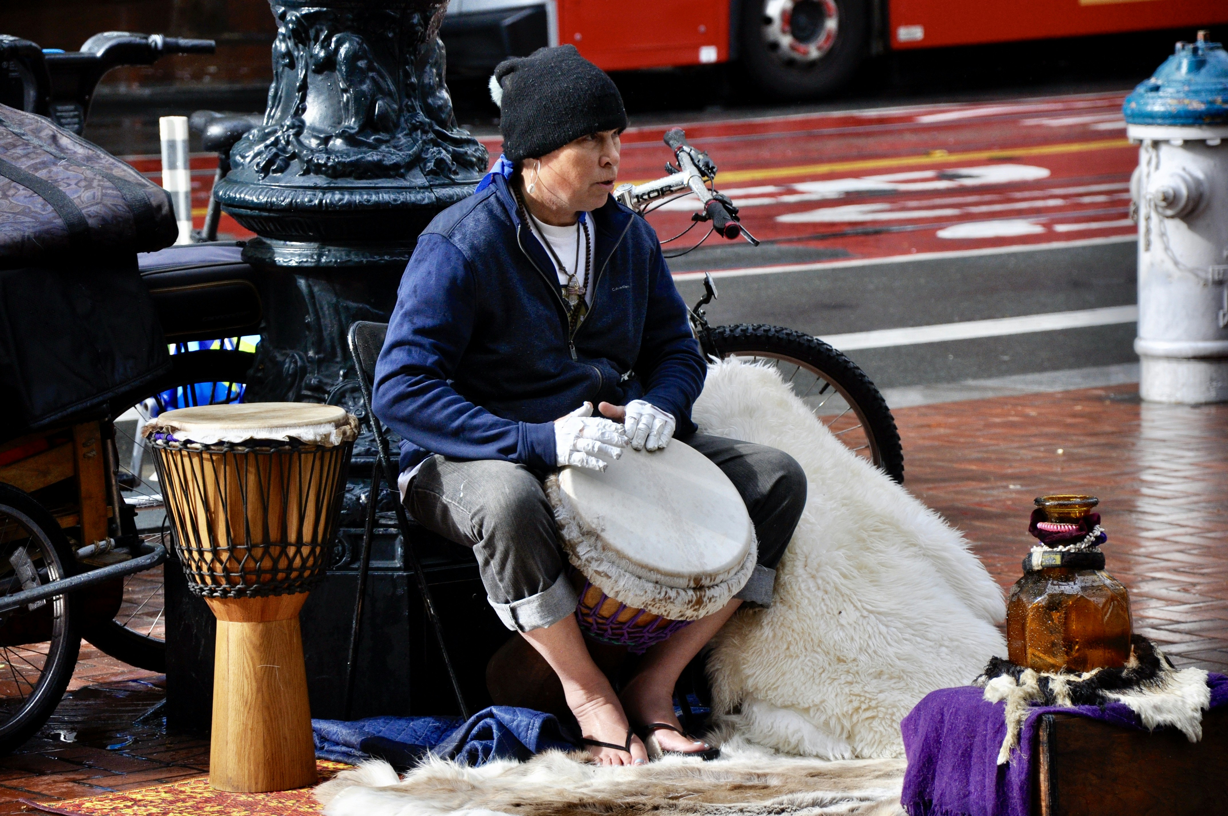 Djembe on a Rain-Washed Street: A Busker’s Quiet Rhythm
