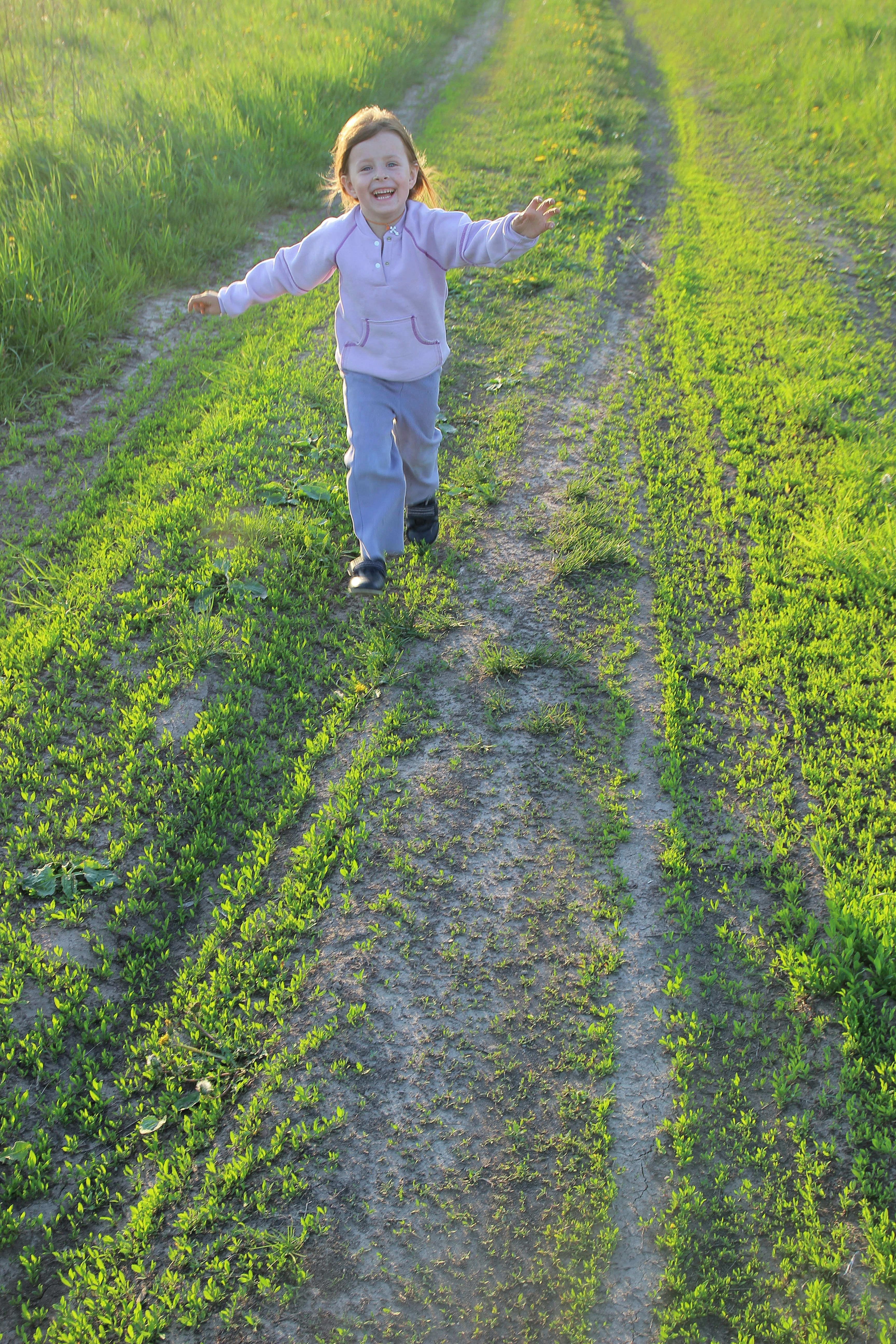 Joyful sprint along a sunlit country path