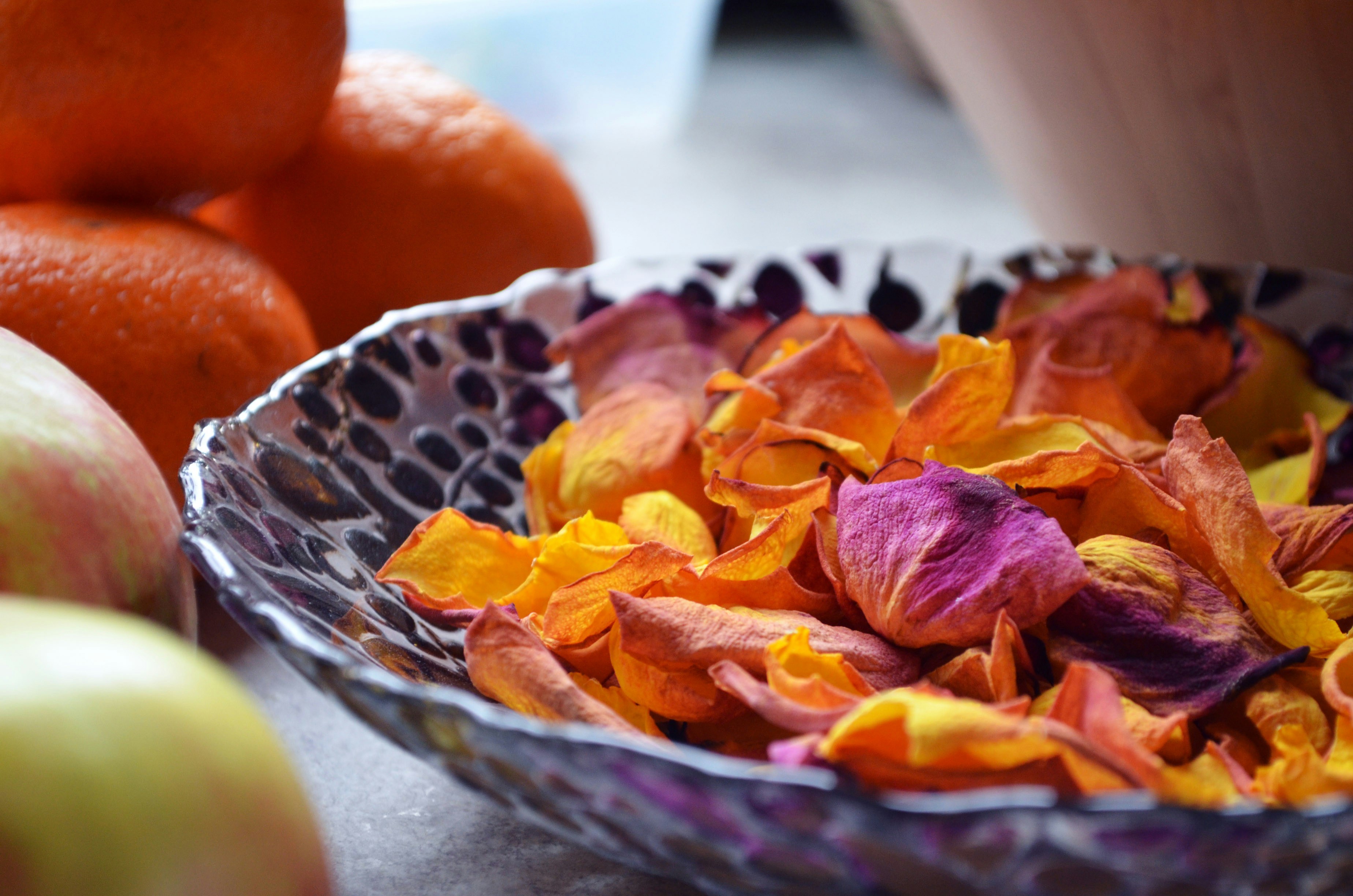 Petal Mosaic in a Ceramic Bowl: Autumn Colors with Citrus and Apples