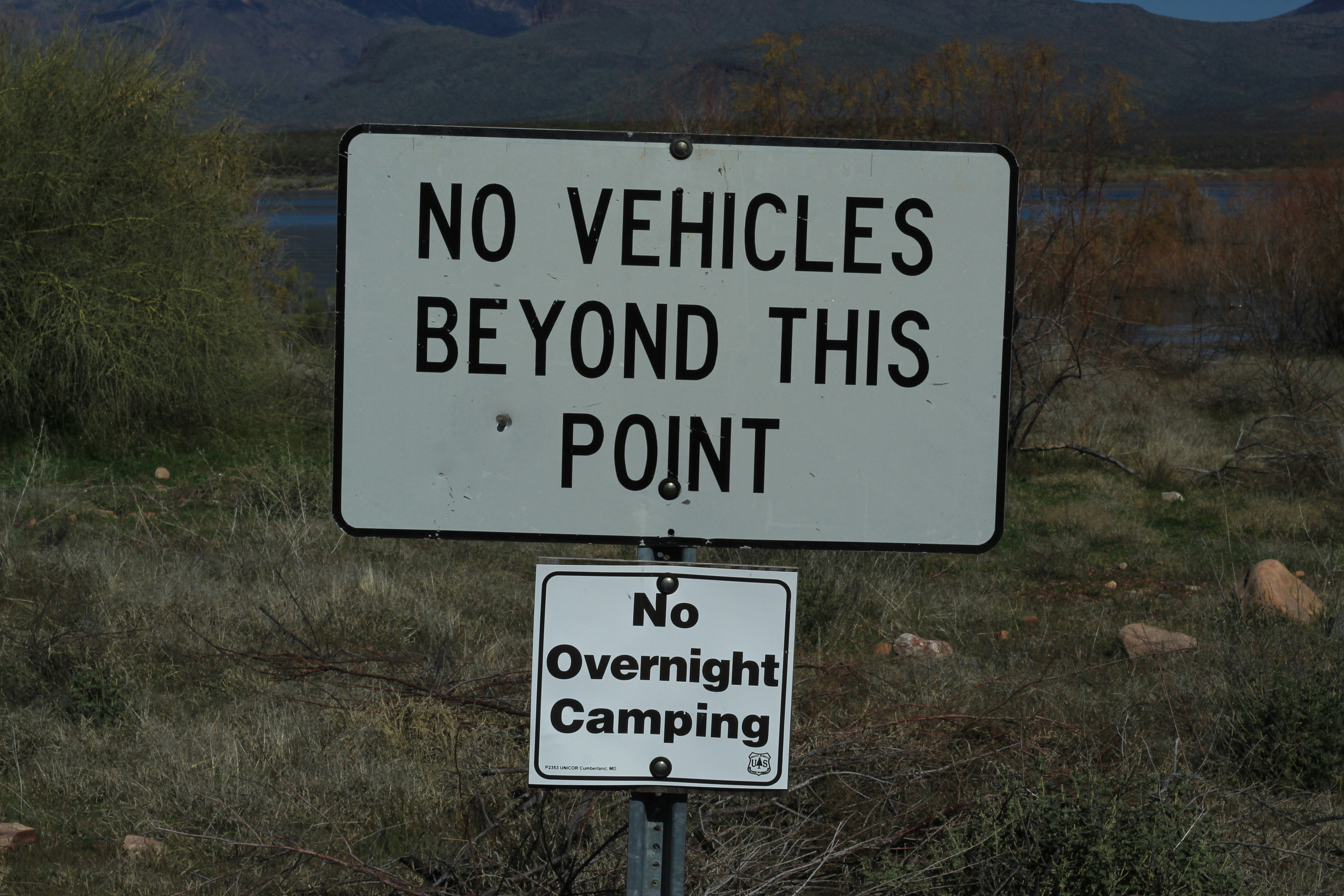 white and black road sign