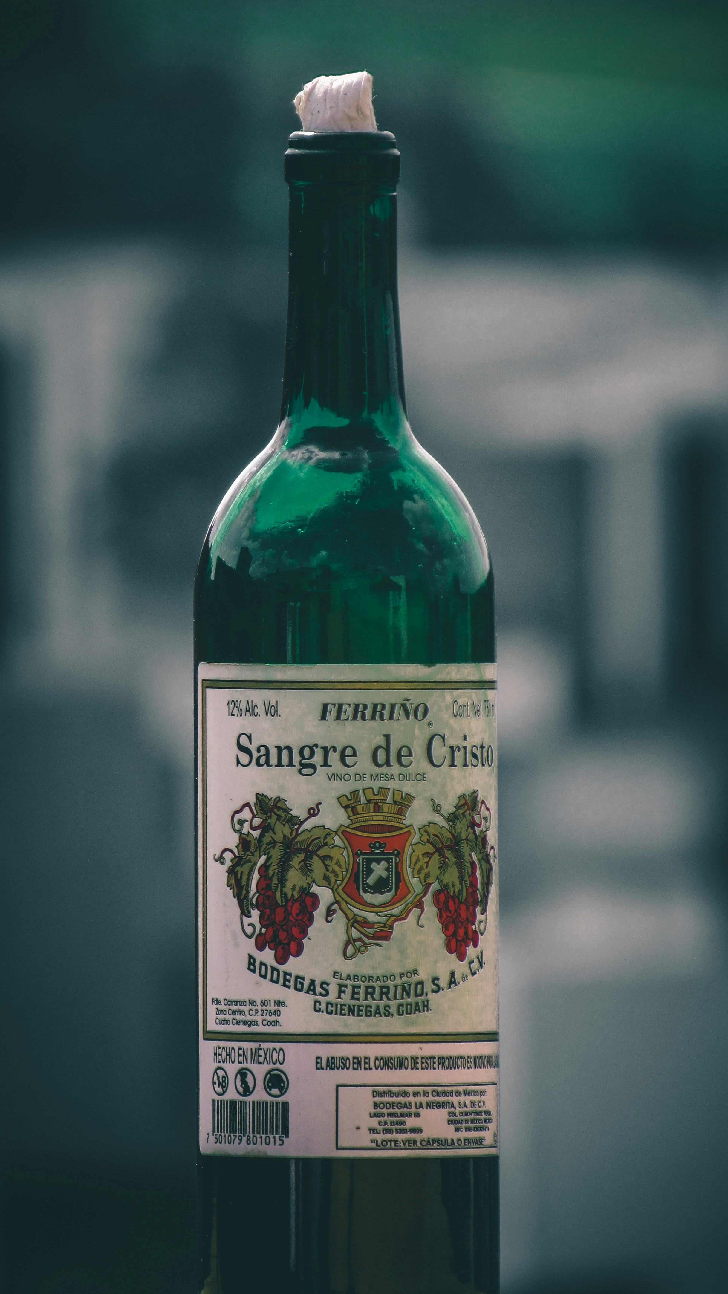 a bottle of wine sitting on top of a table