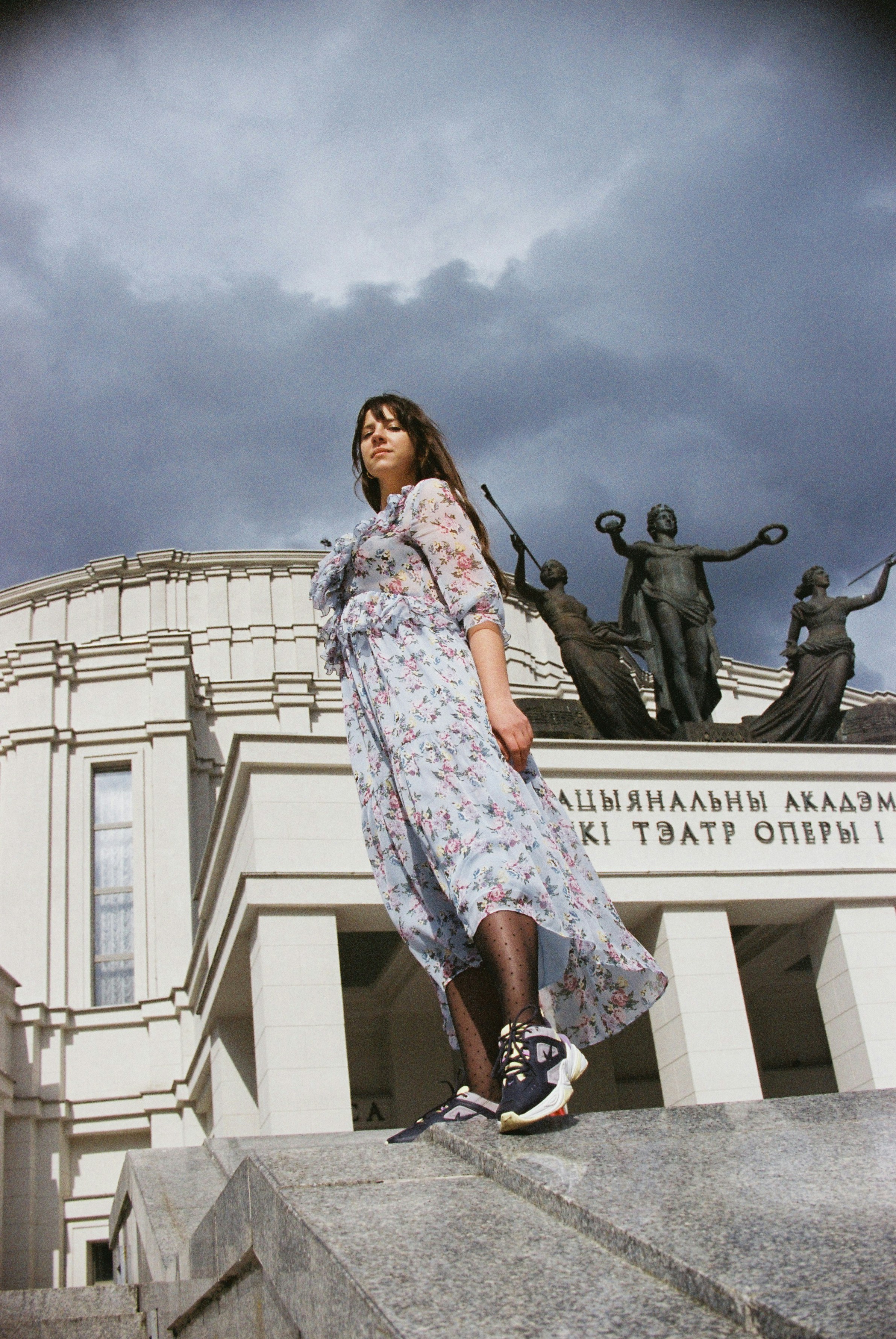 Woman in white and blue floral dress standing near statue during daytime photo – Free Minsk ...