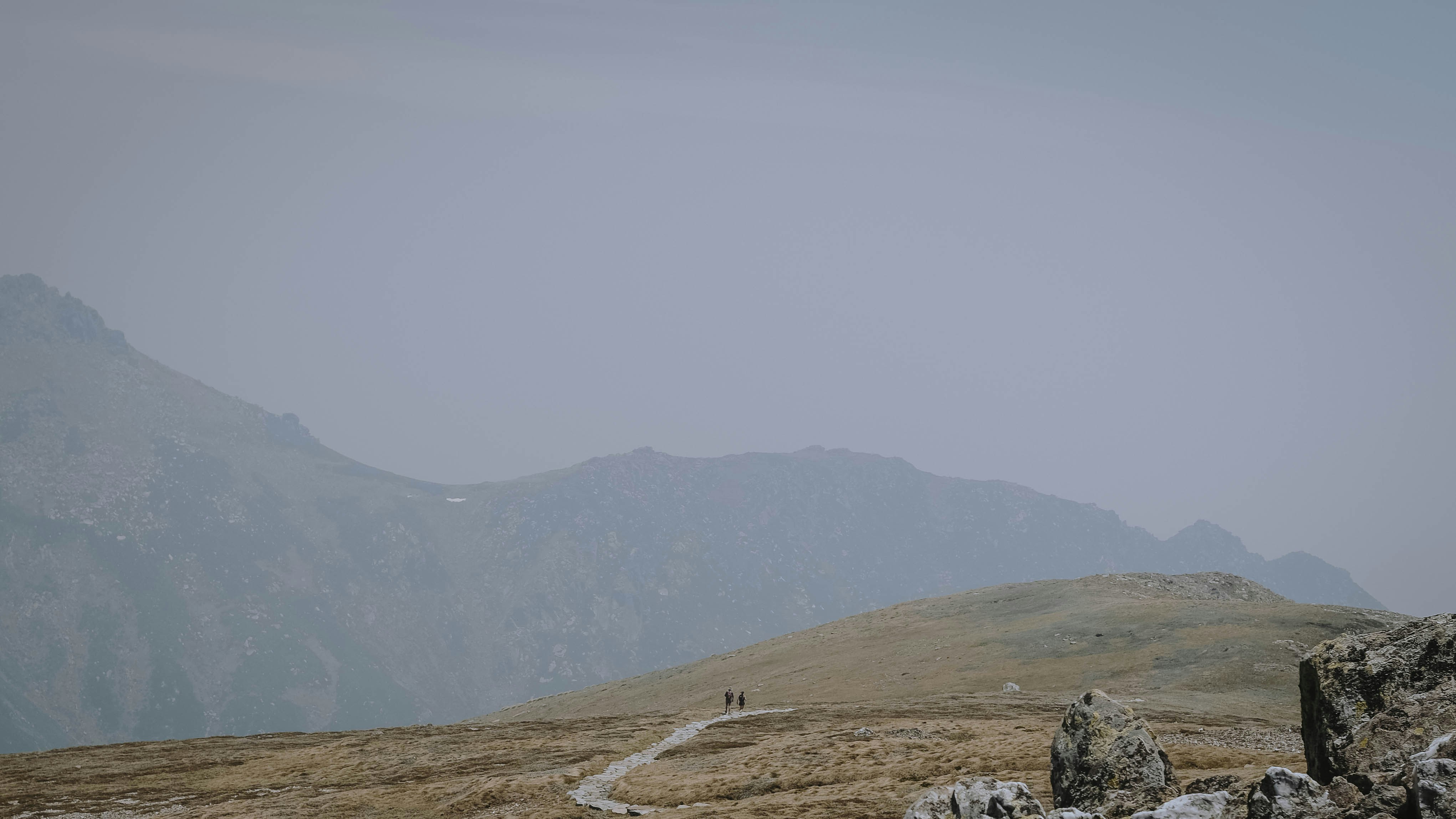 Gray road in the middle of the mountains photo – Free Grey Image on ...