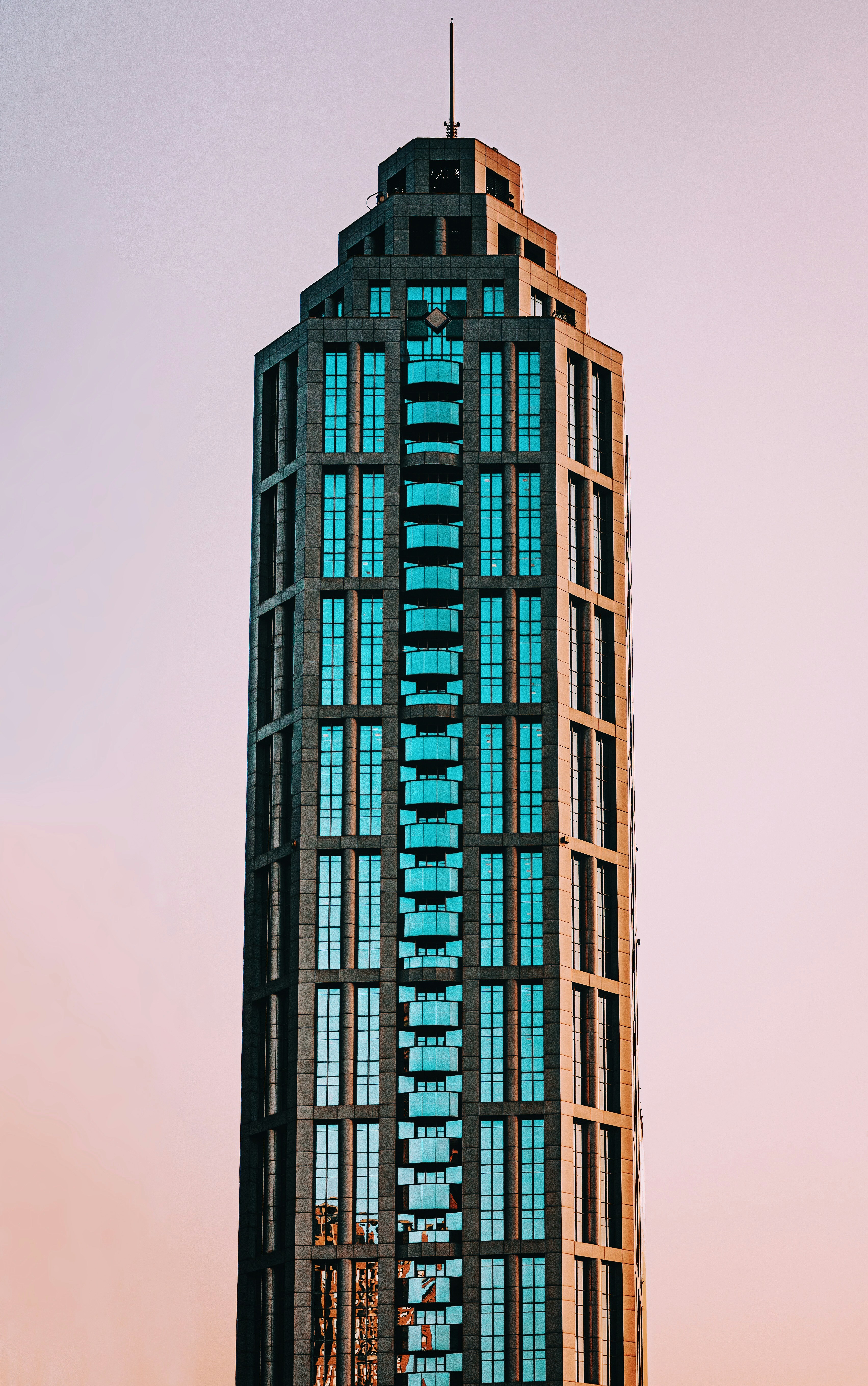 Azure Glass Spine Rising Against a Pink Dusk