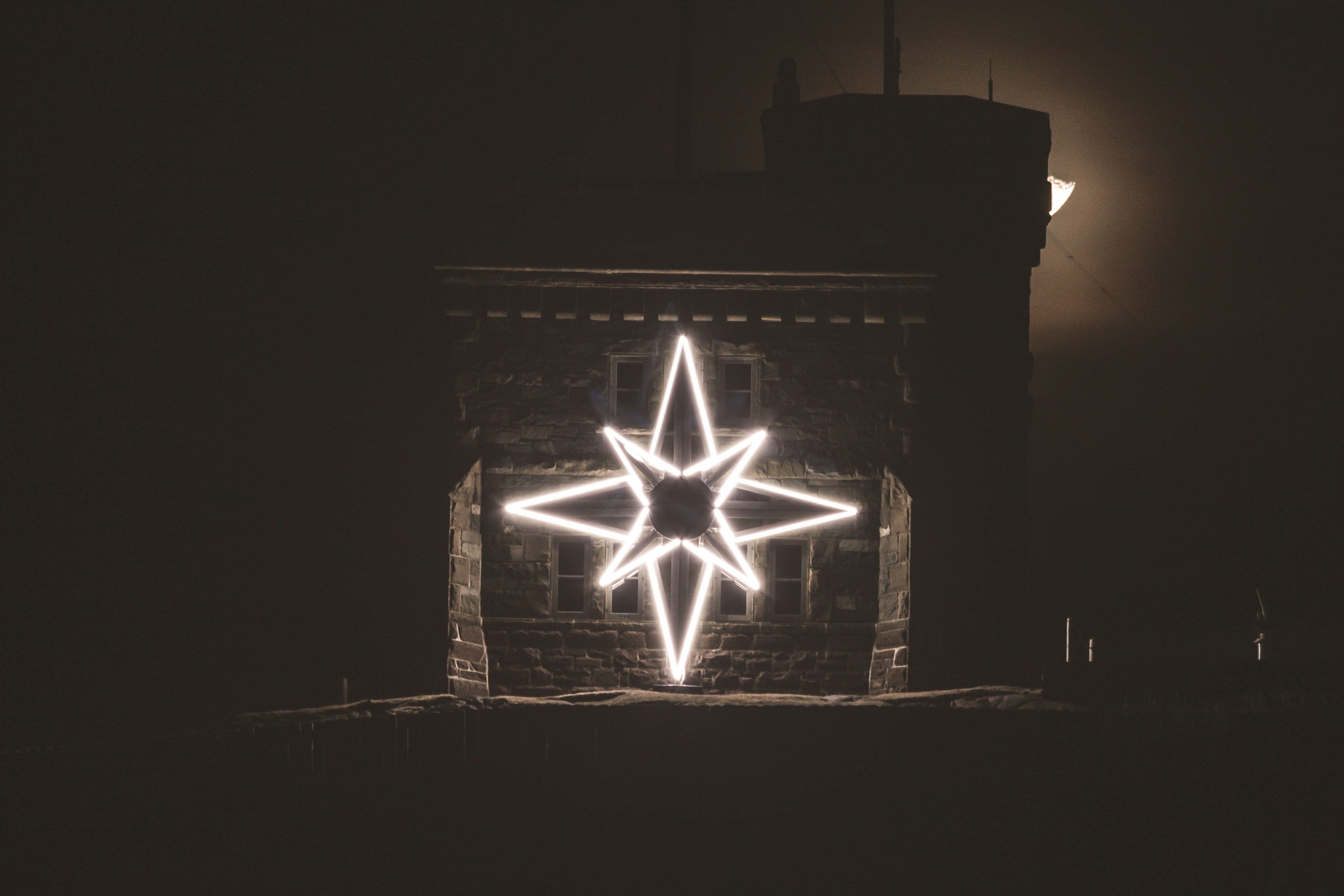 Moonlit Bastion: Neon Star Over Stone Wall