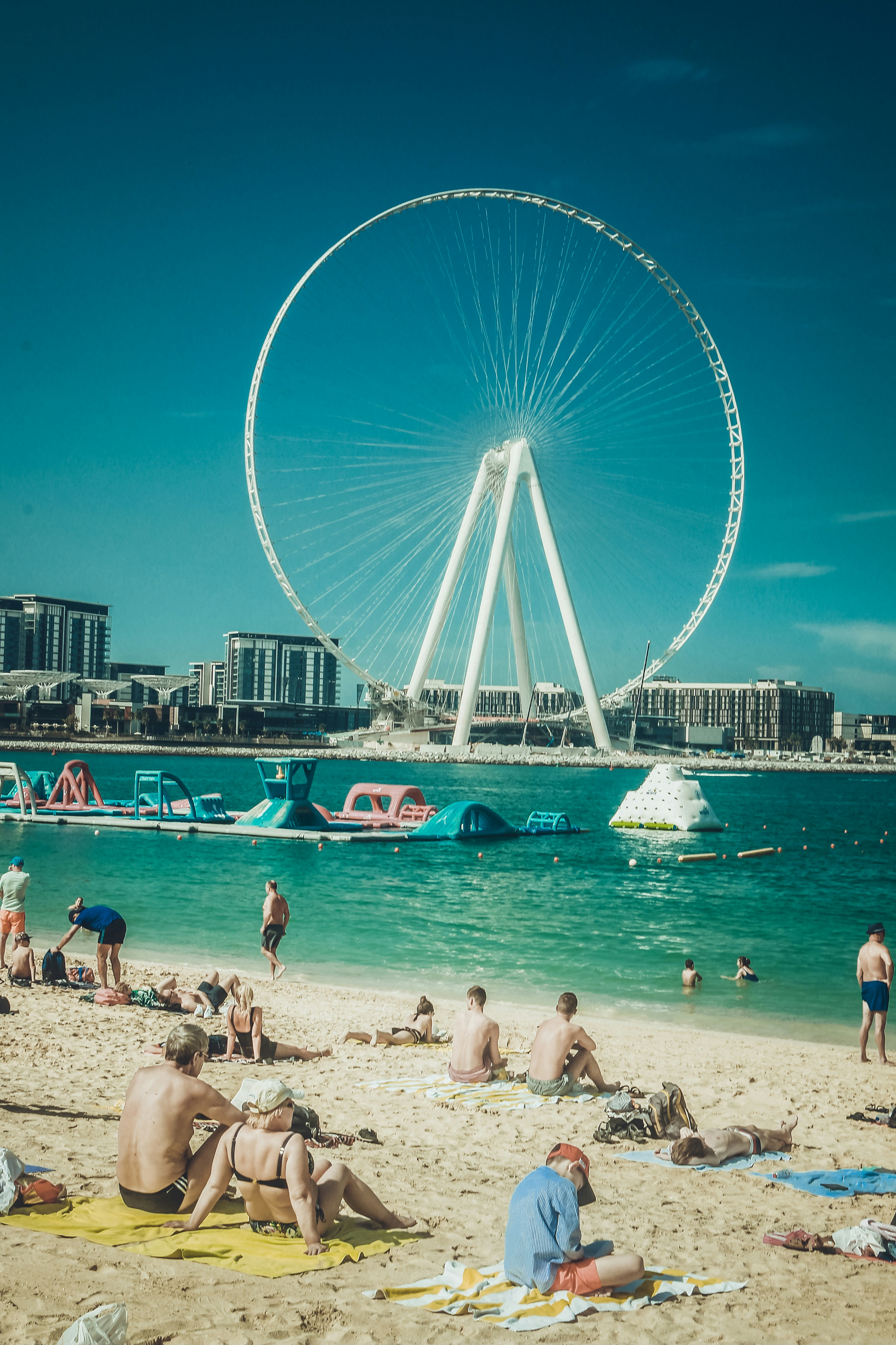 Ain Dubai Rising Over a Sunlit Beachfront