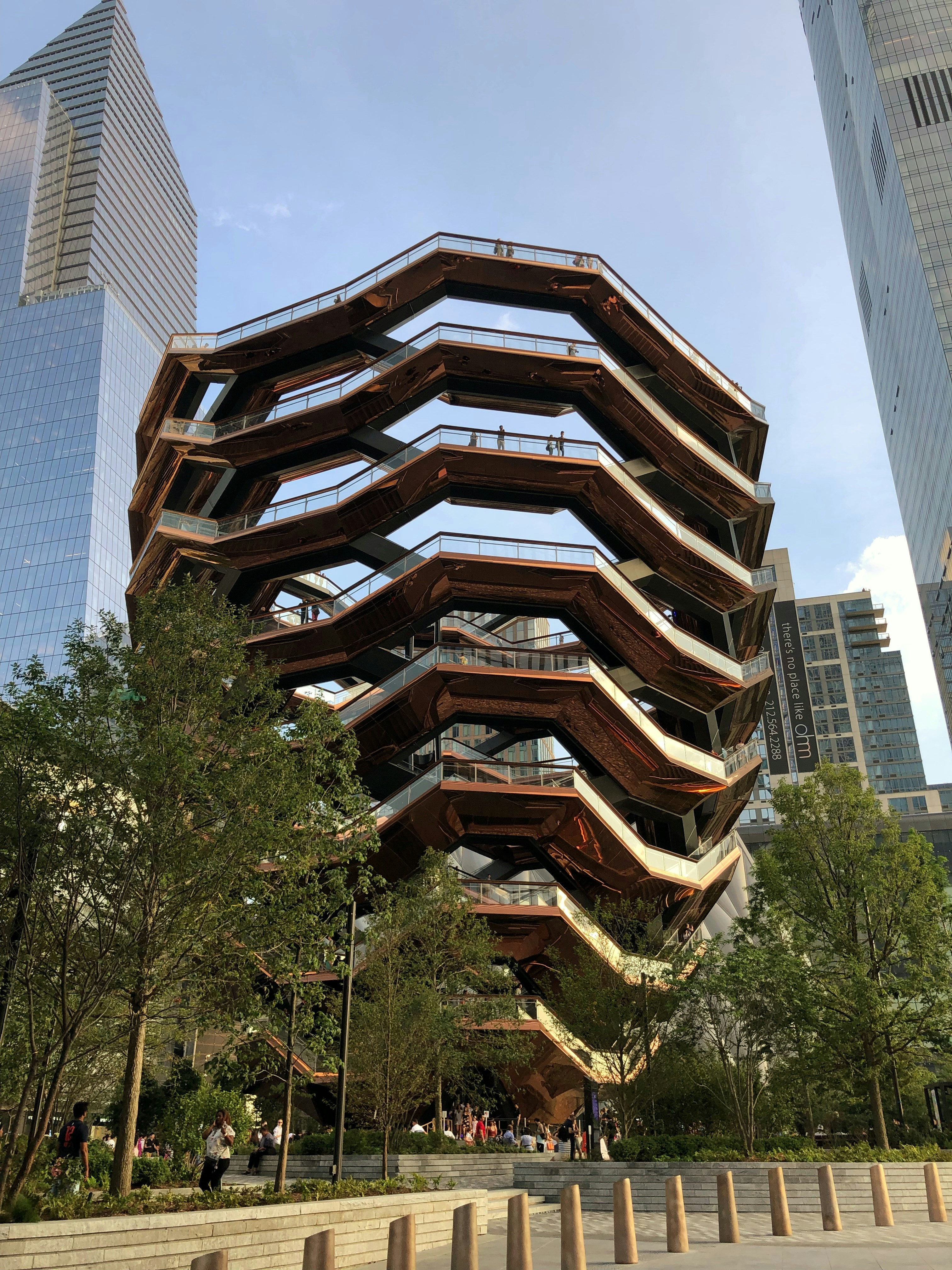 Copper Lattice Ascending Among Glass Skyscrapers
