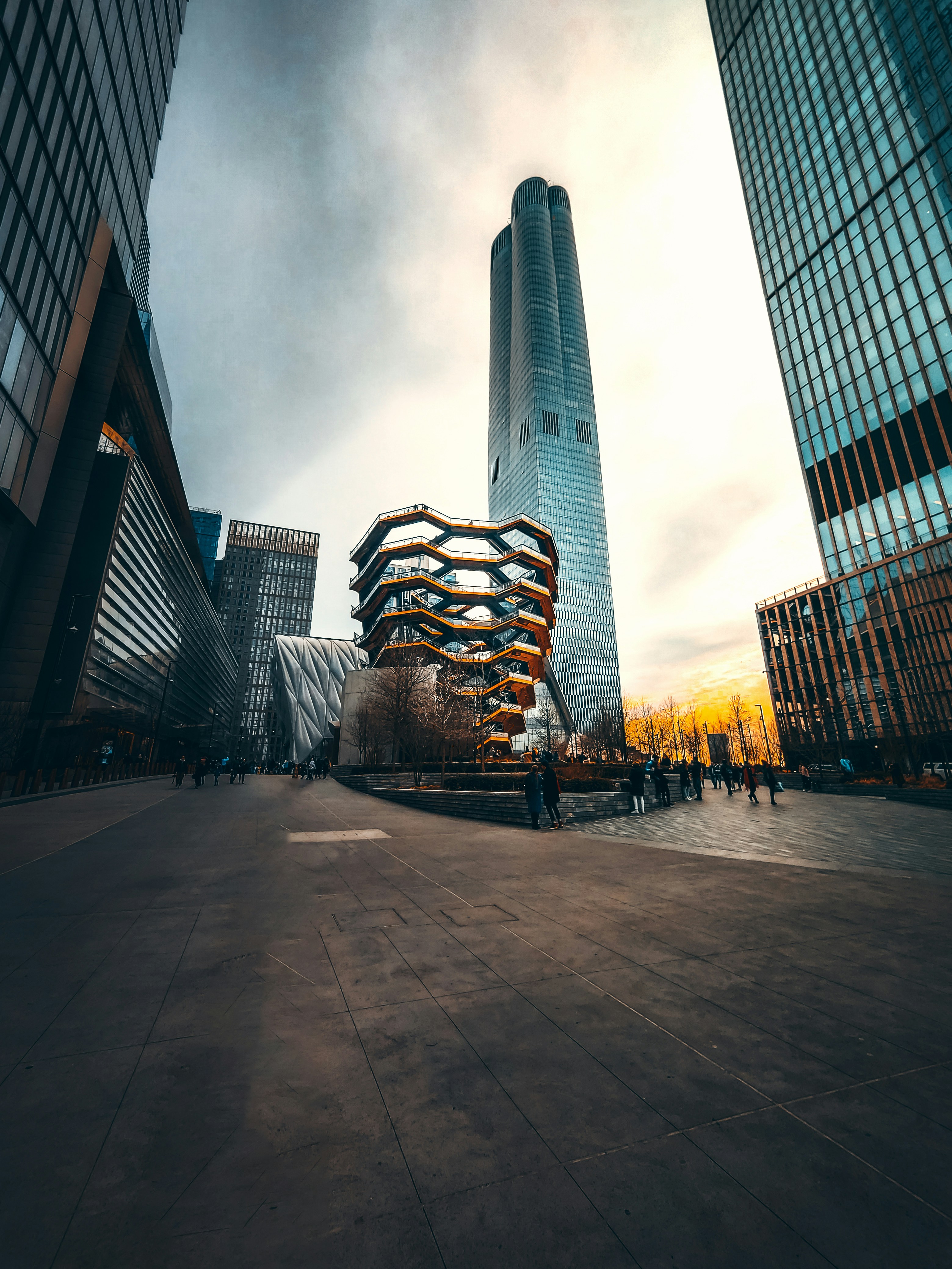 People walking on sidewalk near high rise buildings during daytime ...
