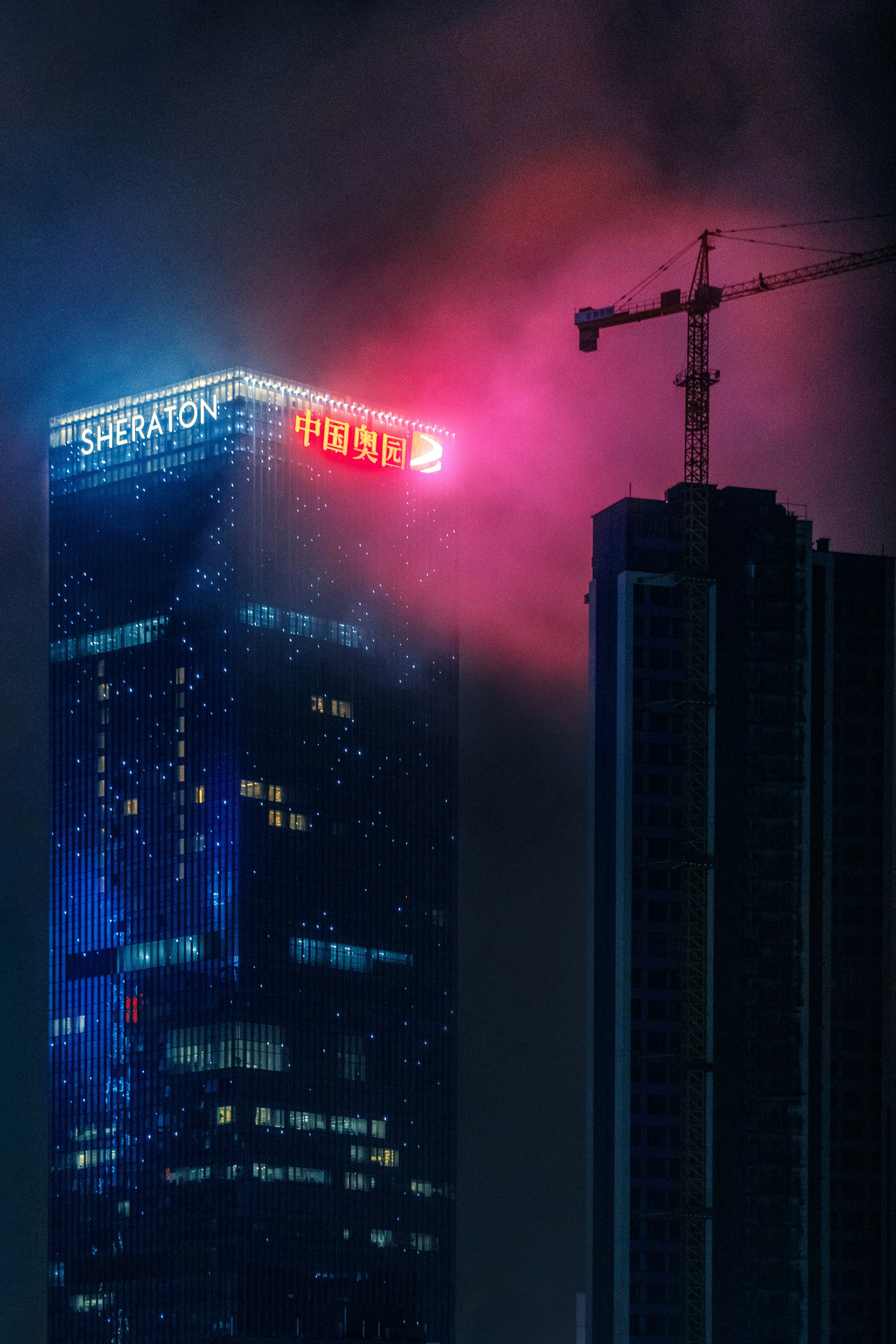 Lights crossing through clouds.