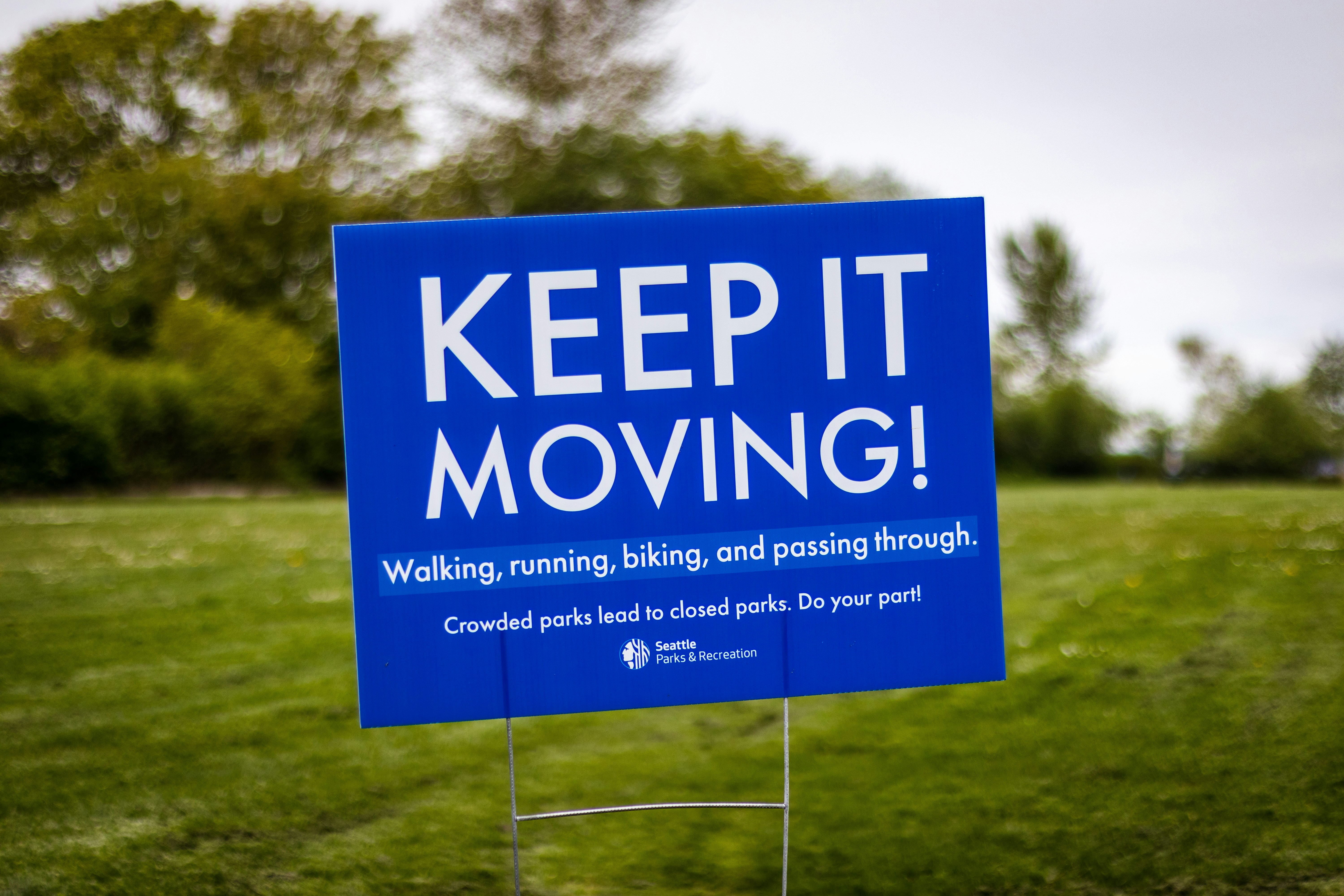 A blue sign that says keep it moving photo – Free Golden gardens park ...