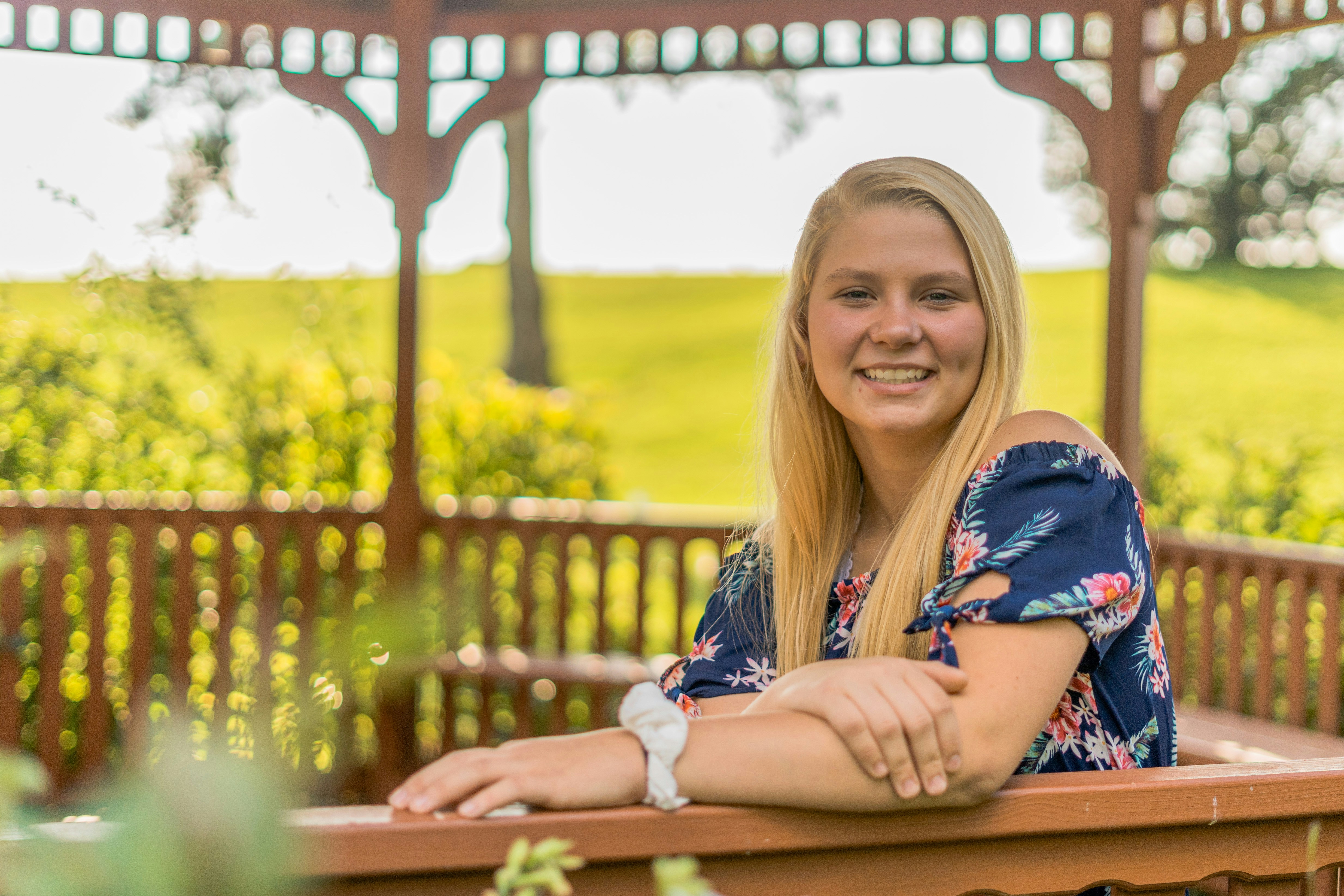 Sunlit Portrait on a Rustic Pergola