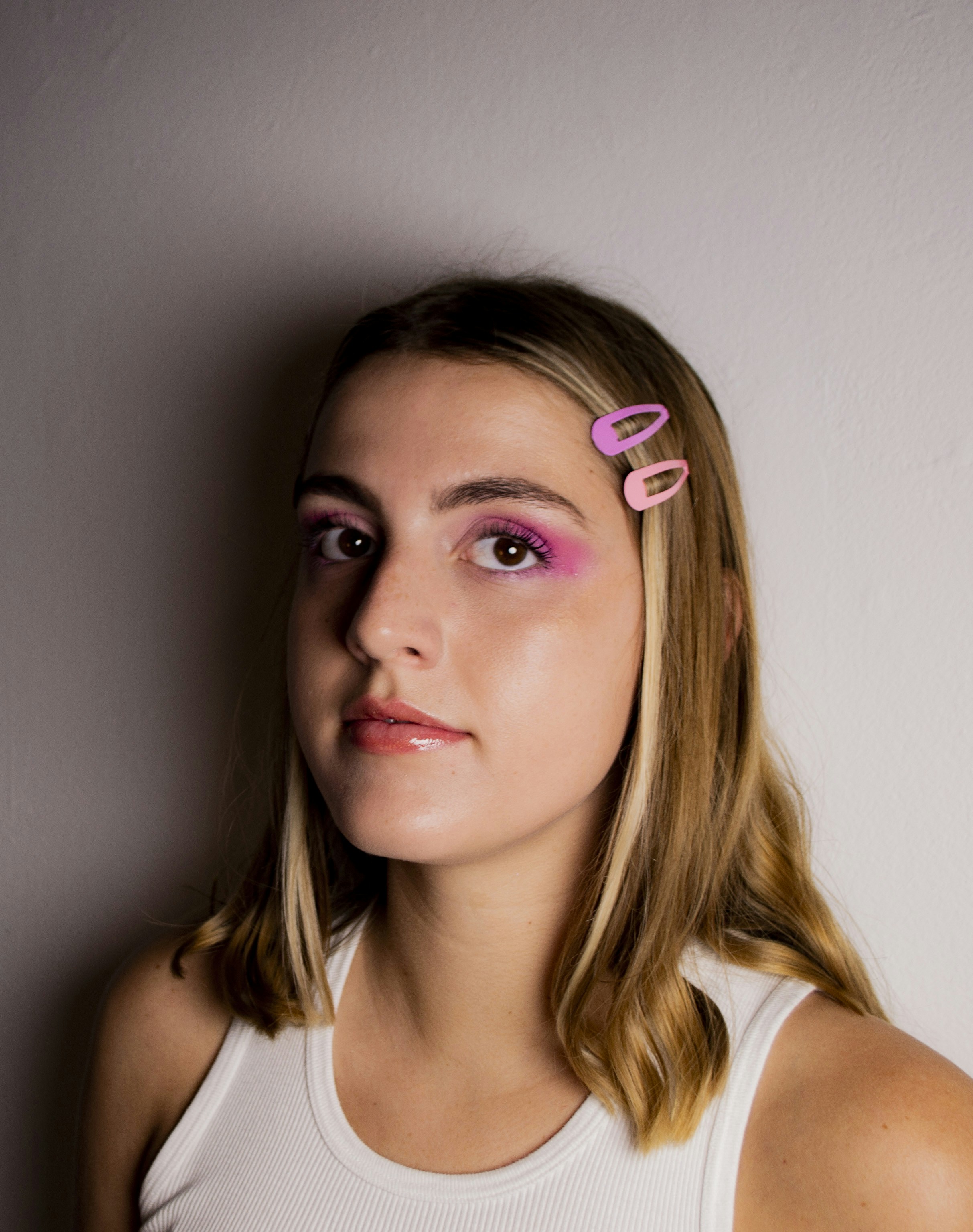 Pink Spotlight: A Portrait with Playful Hair Clips