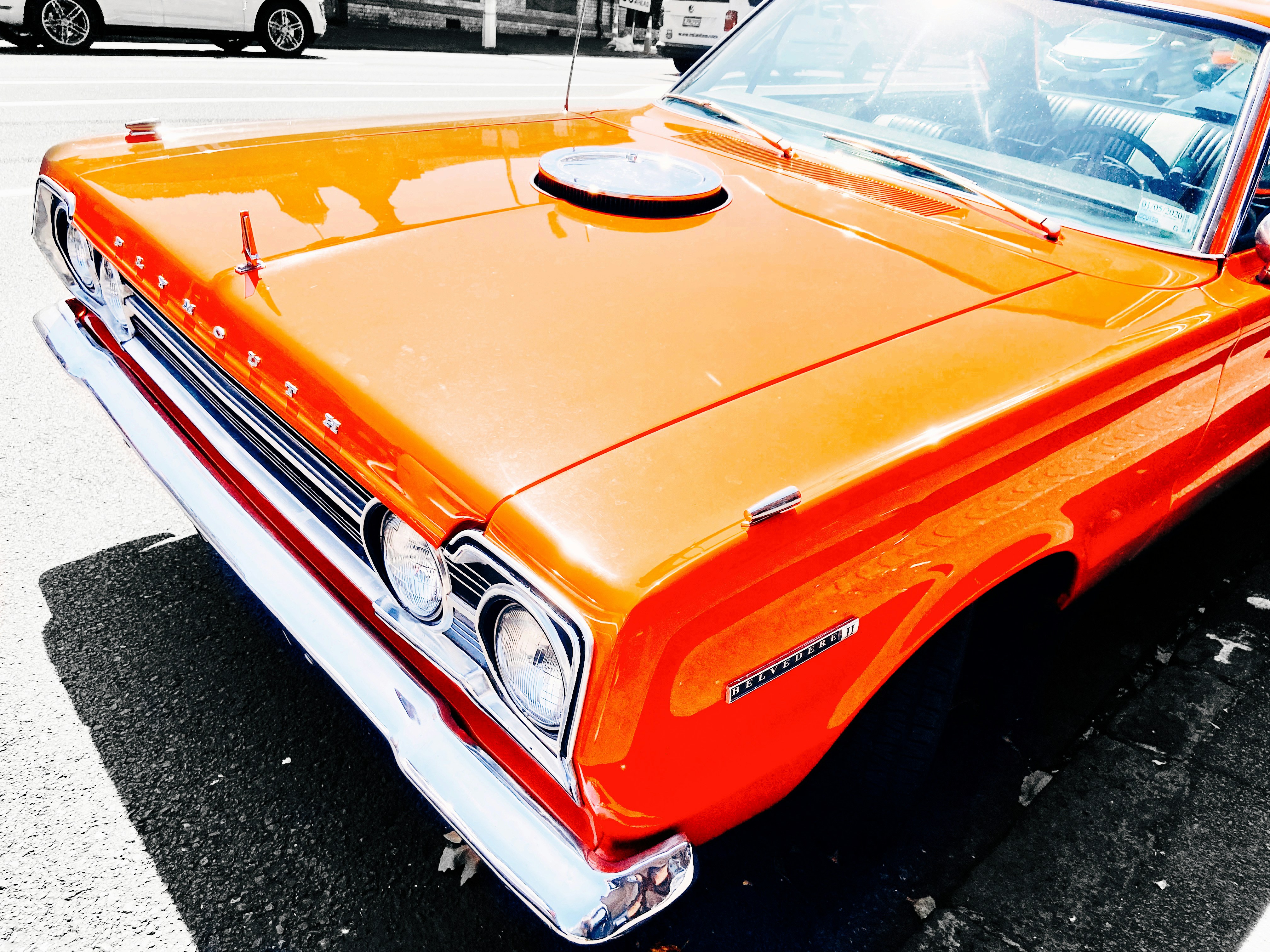 Orange and white chevrolet car photo – Free Grey lynn Image on Unsplash