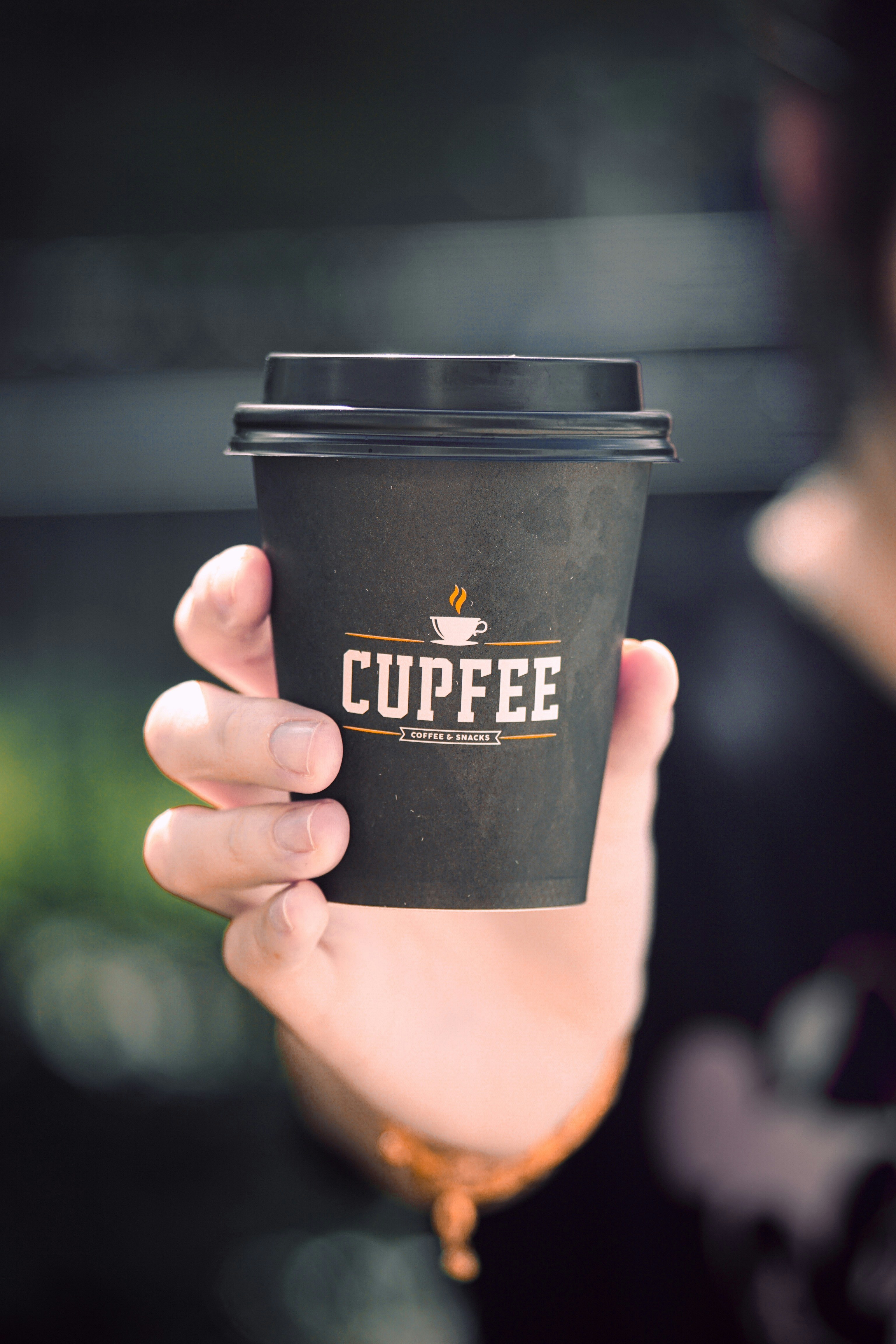 Cup of Confidence: A Handheld Coffee Moment