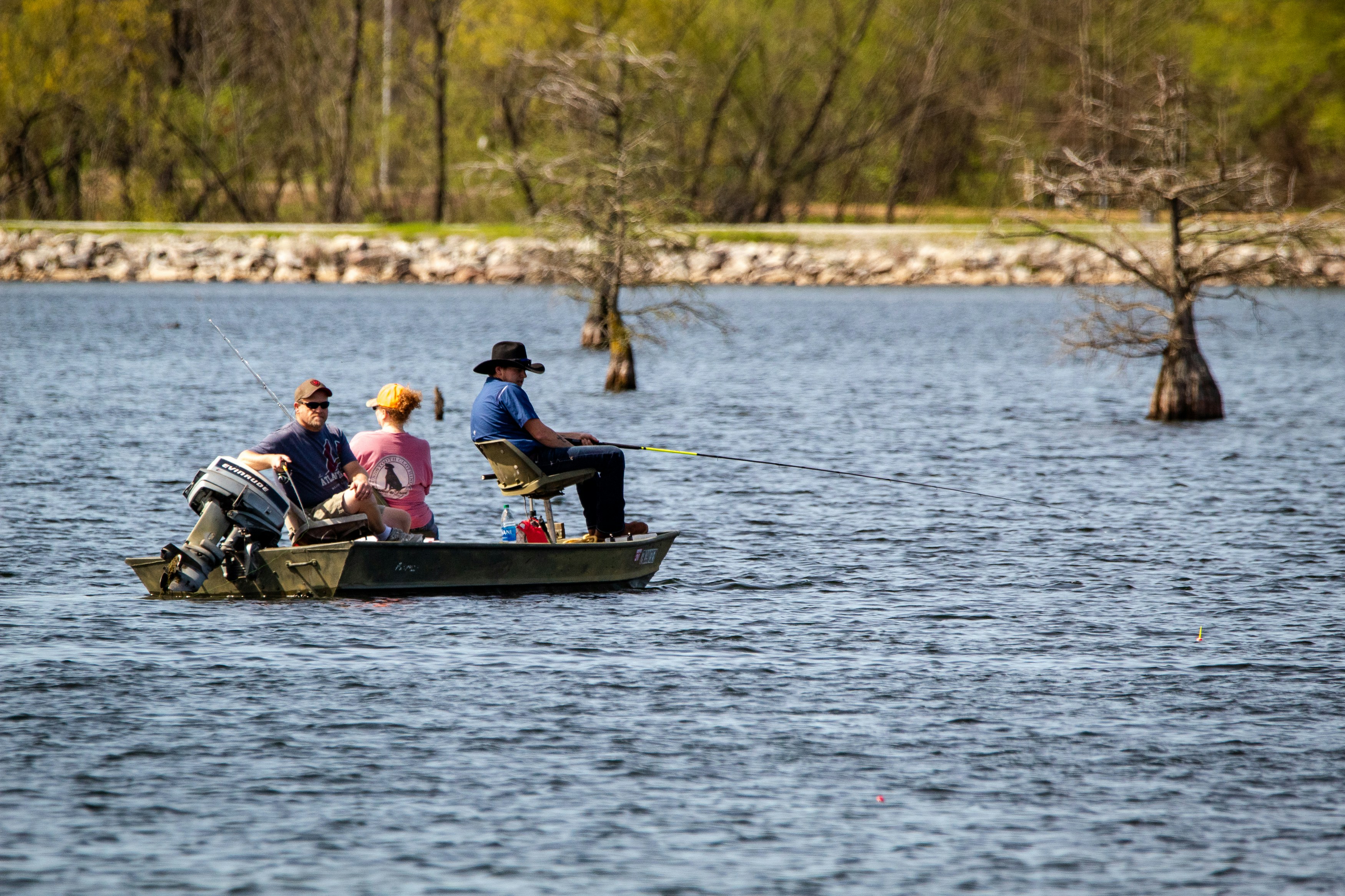 People fishing in Oneal Lake at the Hatchie National Wildlife Refuge.