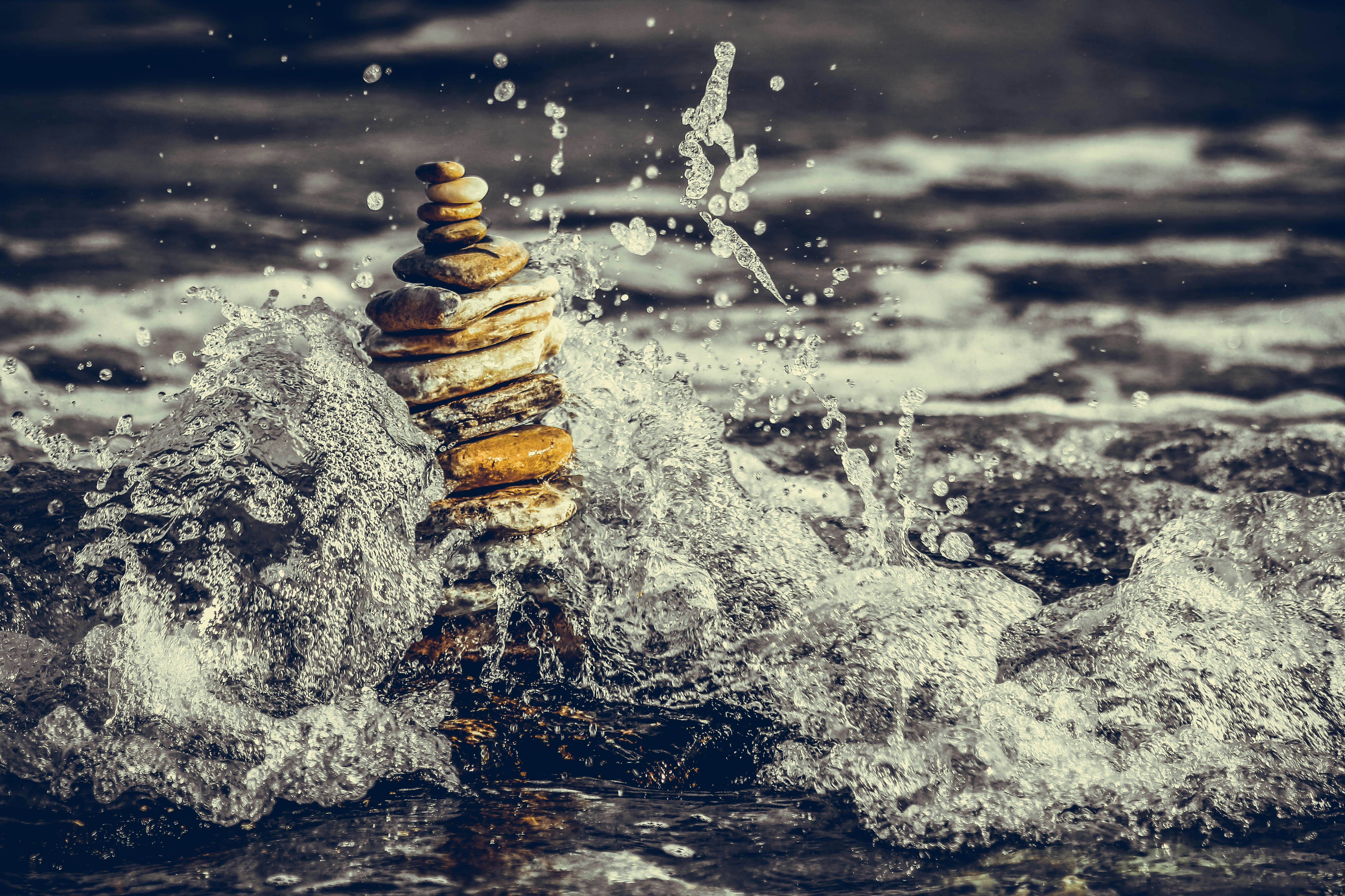 Pebble Pillar: A Stone Tower Rises Through Sea Spray