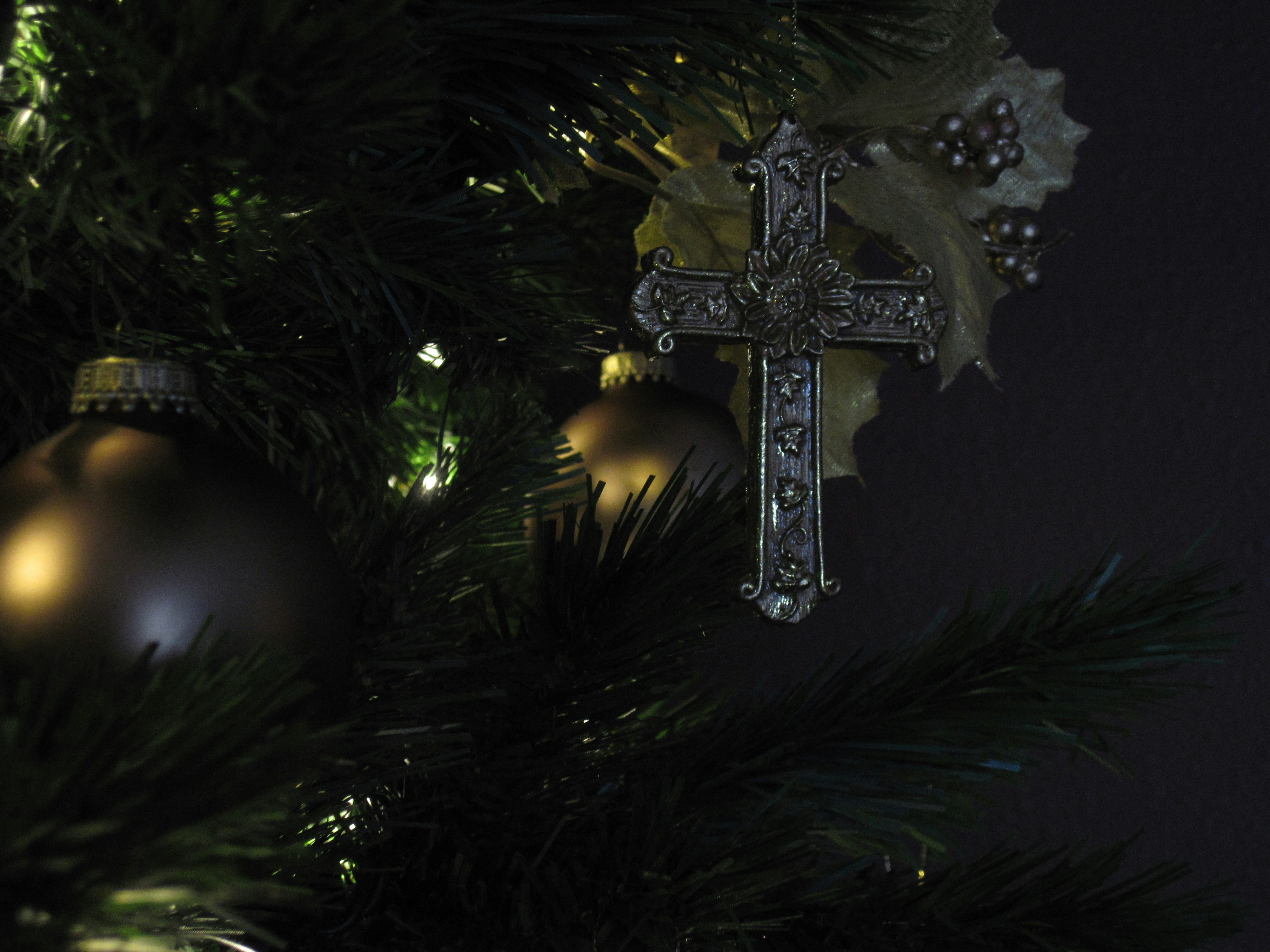 Gold cross on green christmas tree photo – Free Cross Image on Unsplash