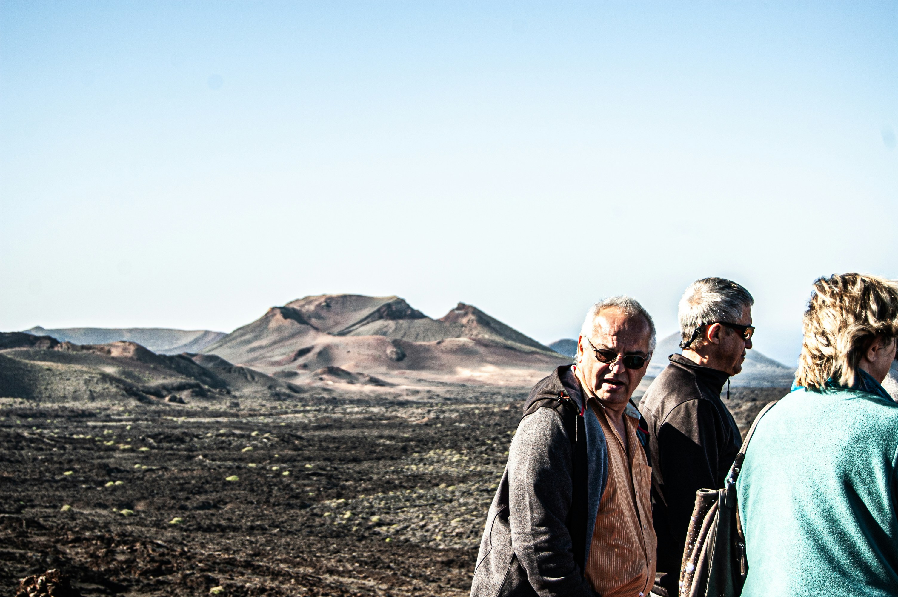 Hikers on a Basalt Desert: a quiet pause under a blue sky