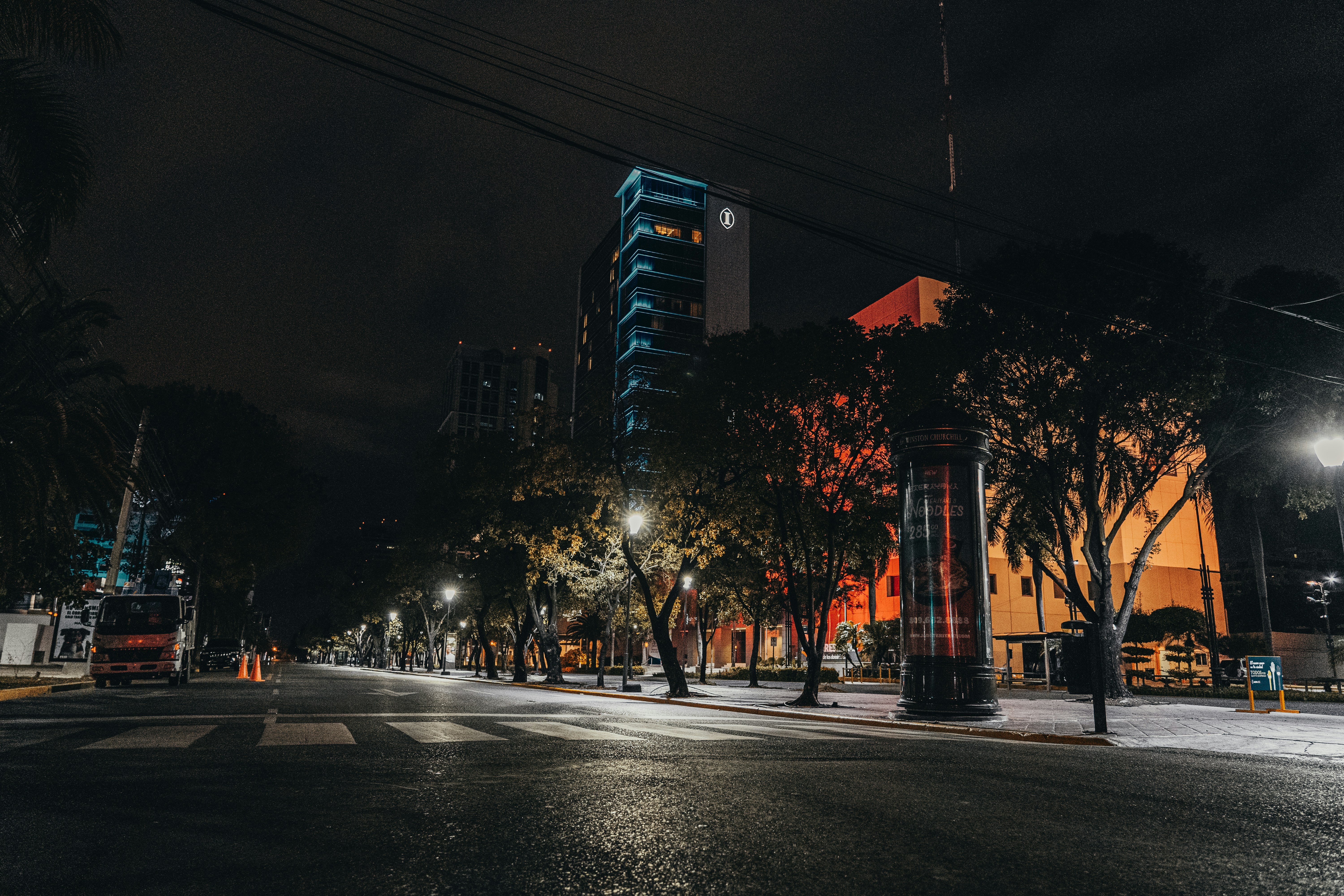 Lighted street light near building during night time photo – Free ...