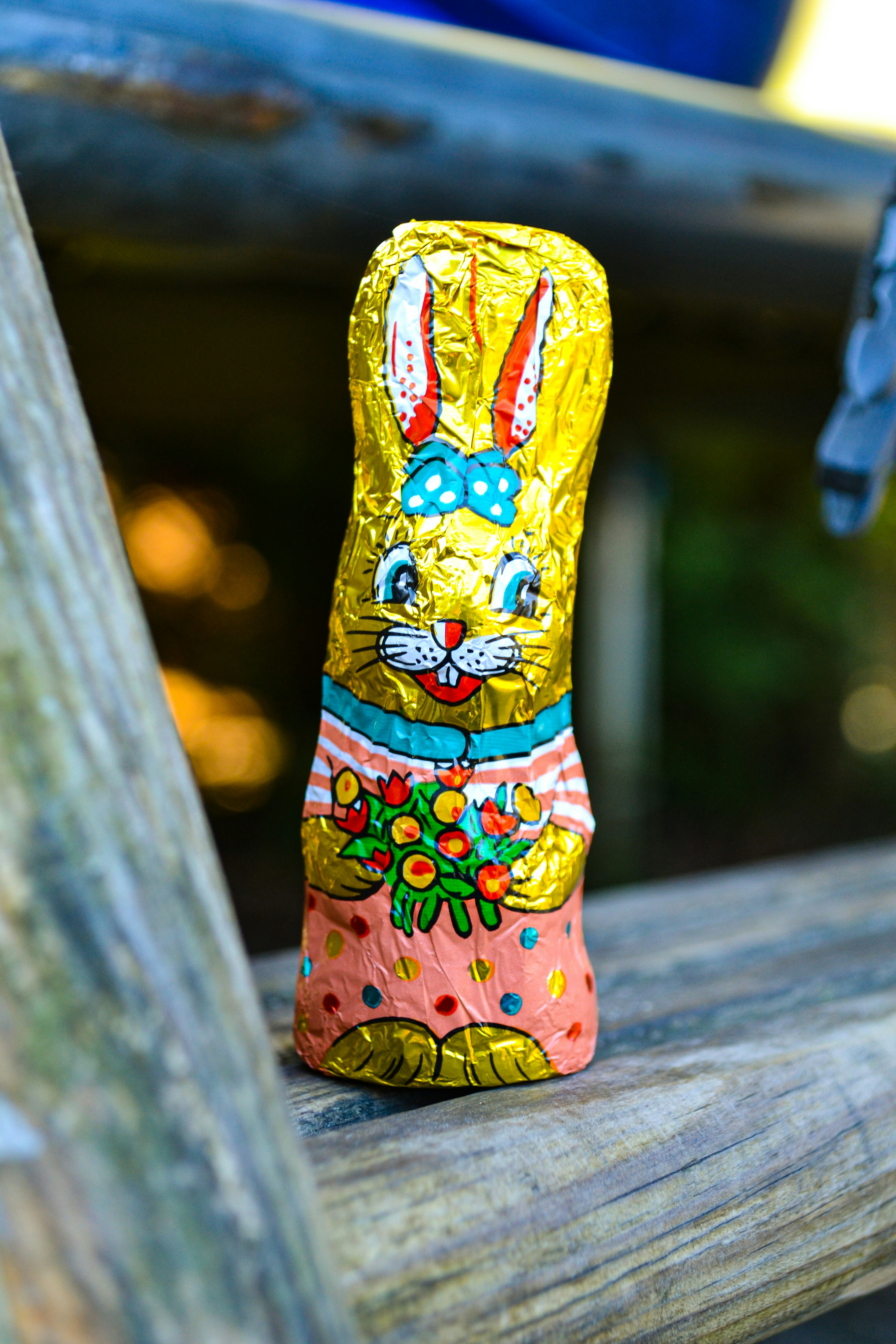 Wrapped Bunny on a Wood Beam: A Colorful Easter Candy Portrait