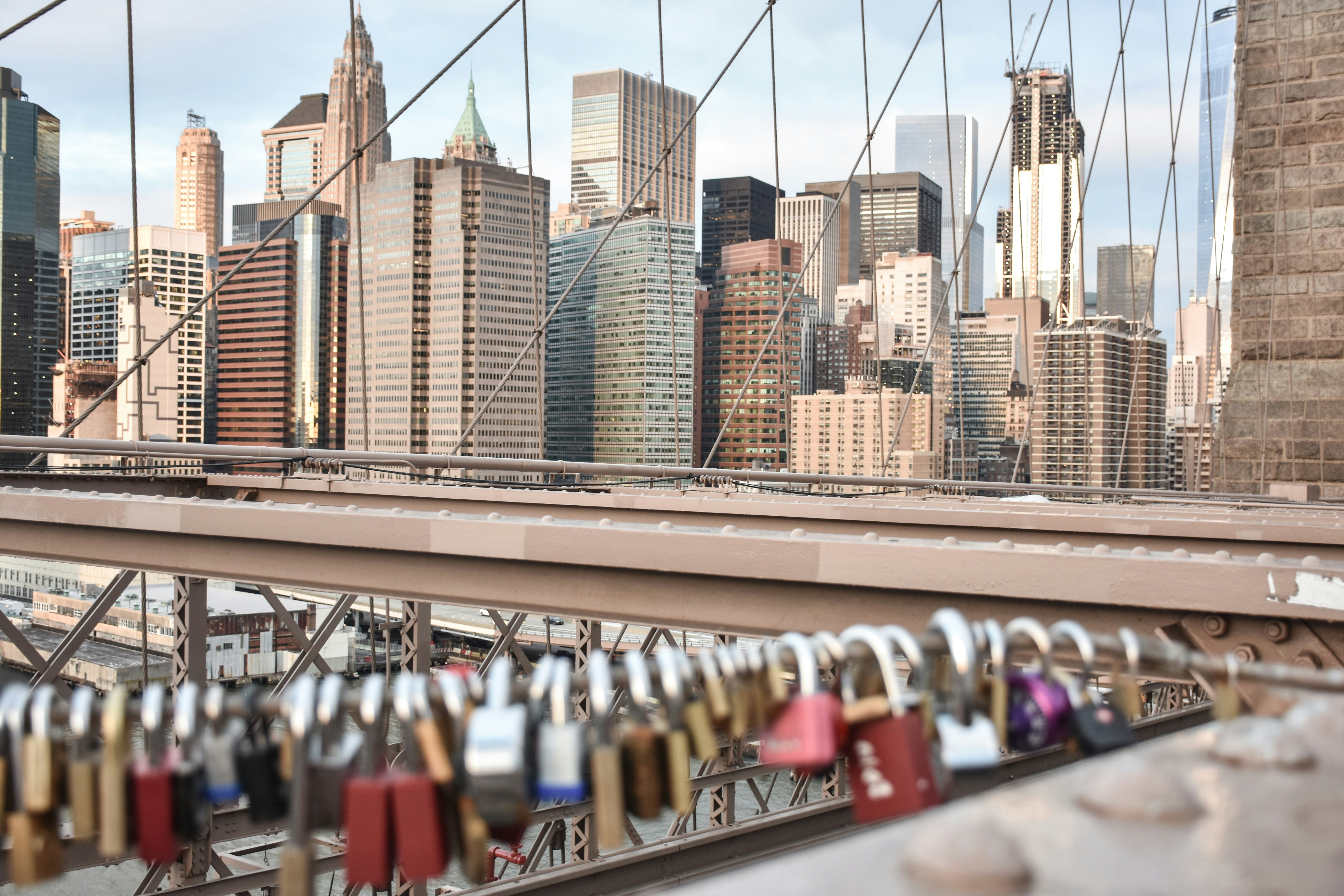 A bridge with a bunch of padlocks attached to it photo – Free Brooklyn ...