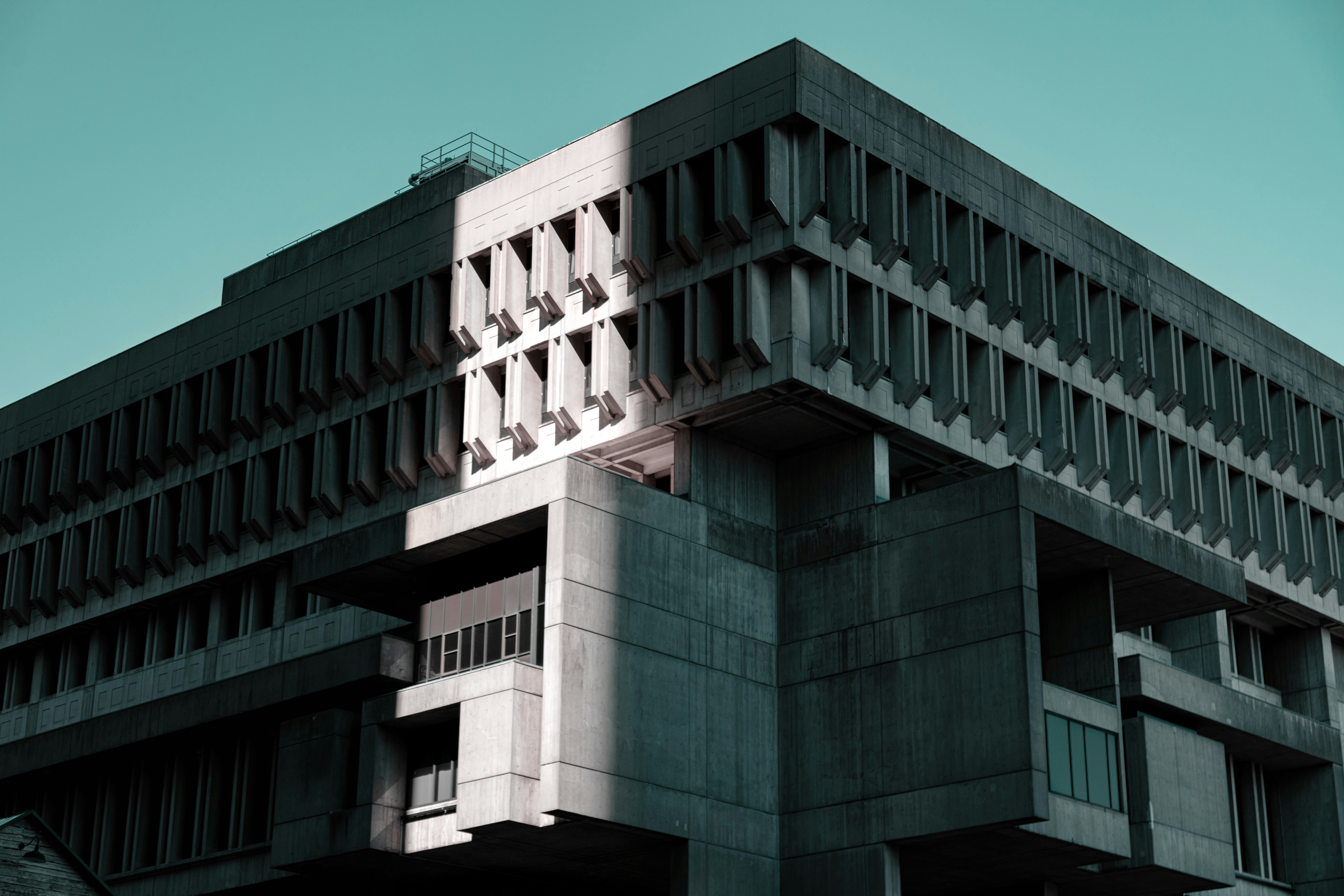 Blue concrete building under blue sky during daytime photo – Free City ...