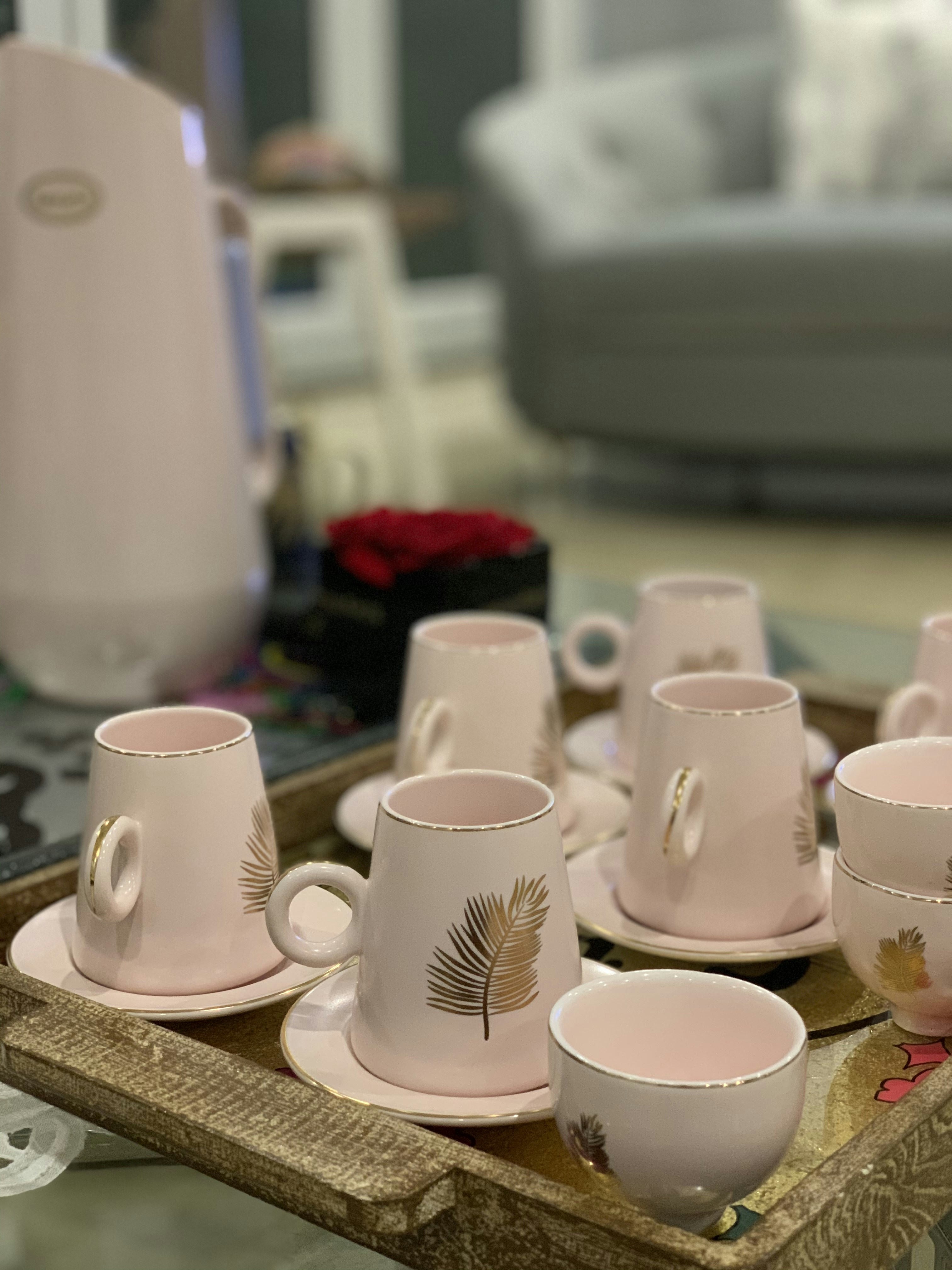 white ceramic mugs on white ceramic saucers