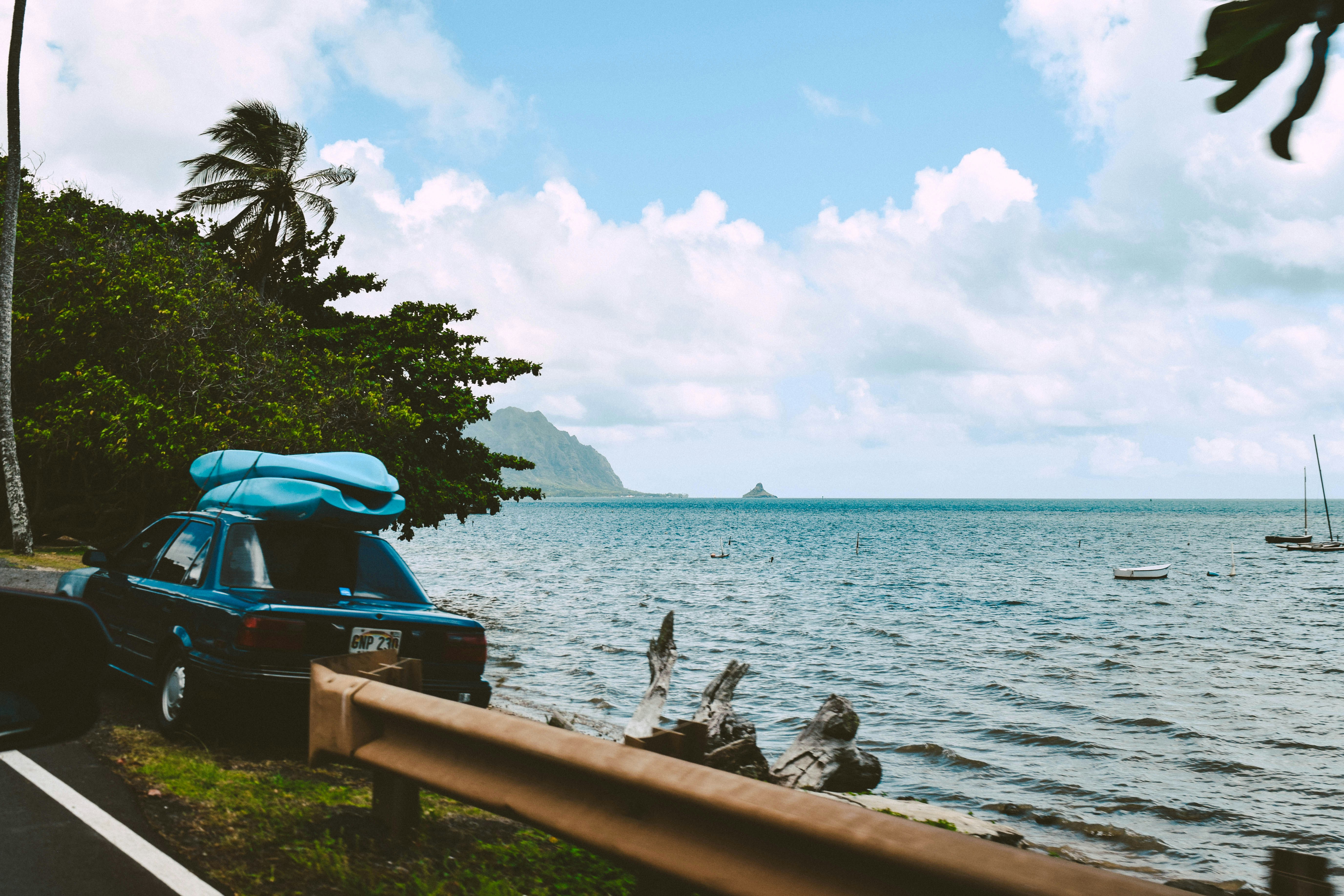 Blue Roofed Car by the Sea: A Breezy Coastal Road Trip