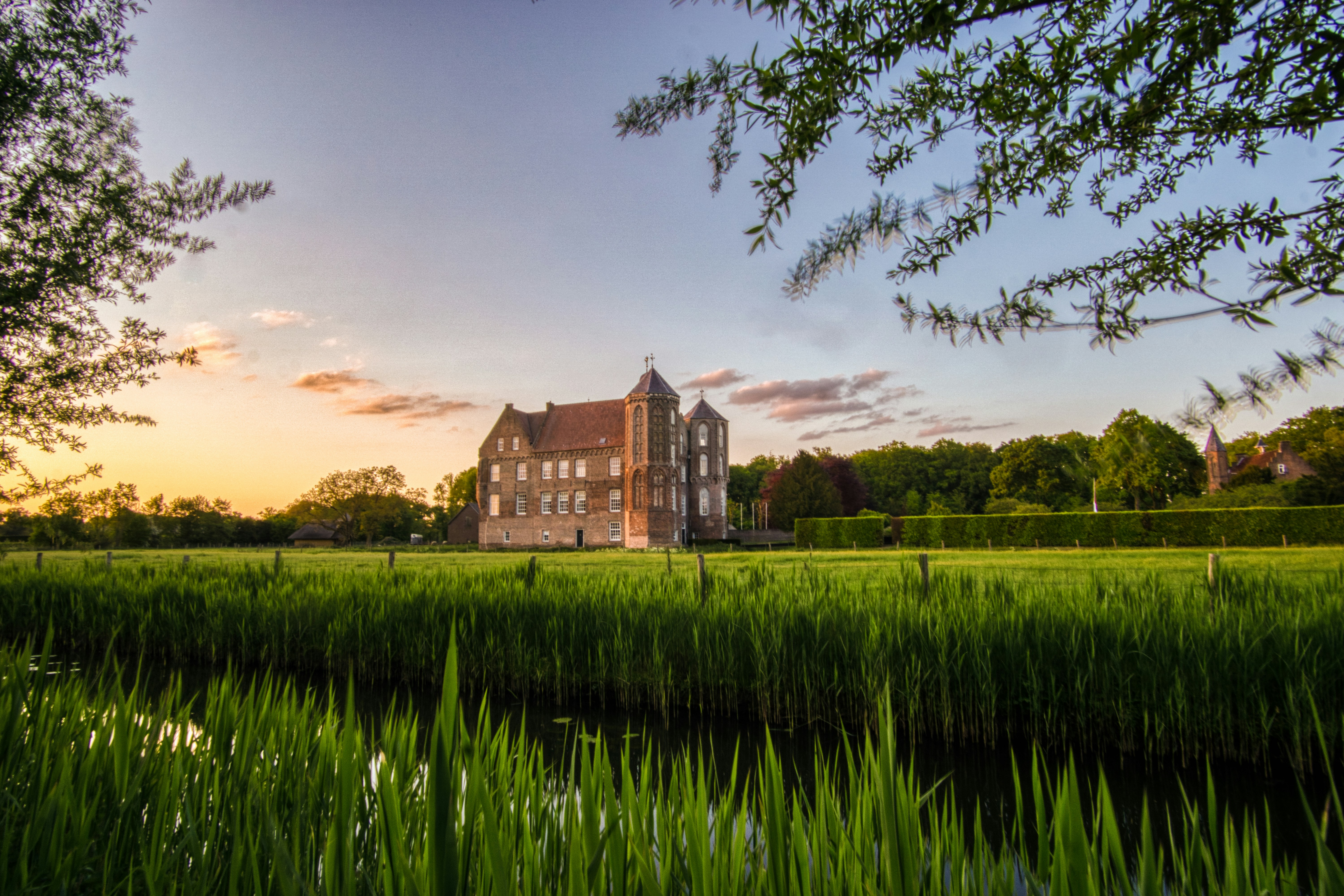 Sunset Over Providence Hall: Brick Edifice Quietly Framed by Verdant Fields