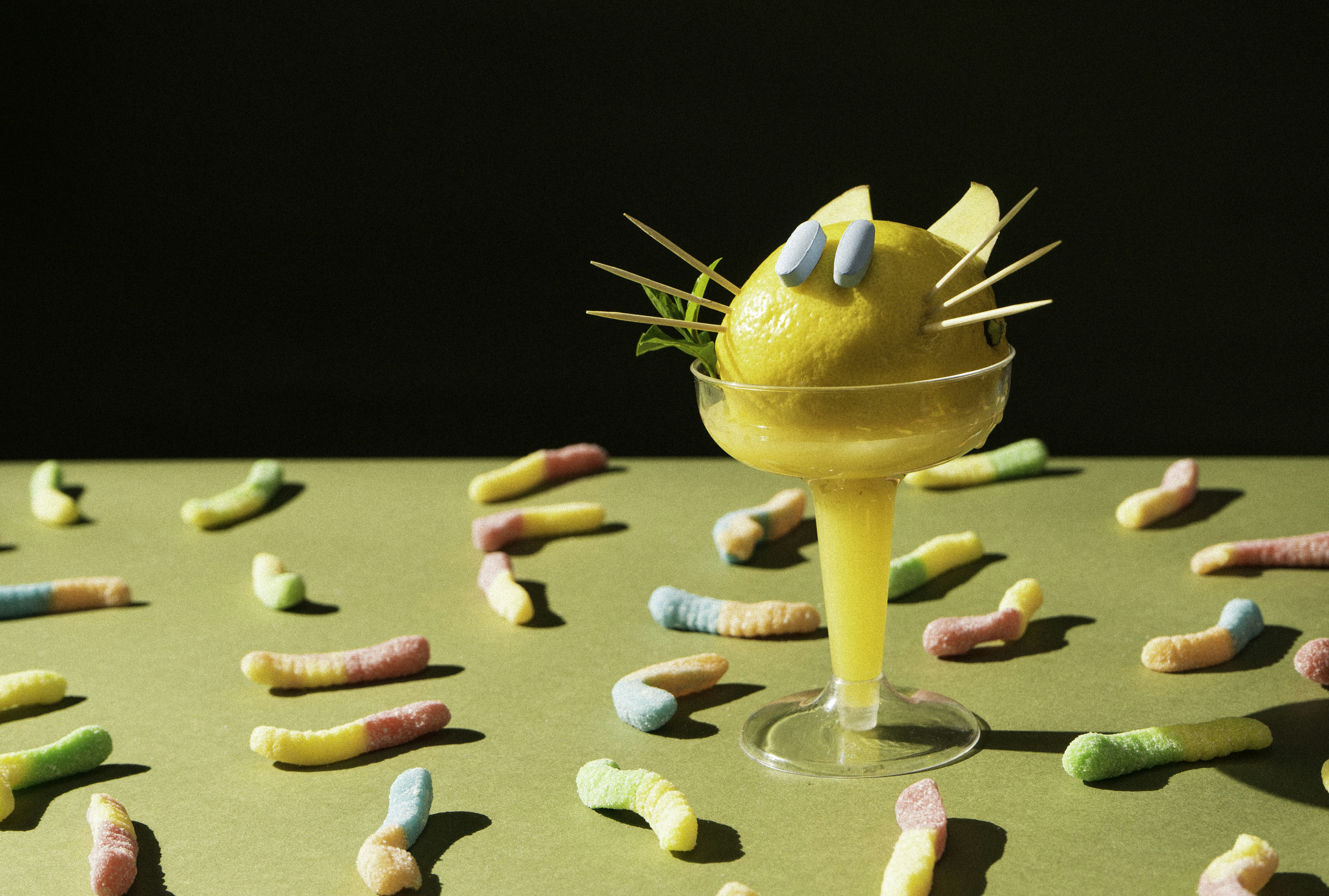 Lemon Mascot Under a Candy-Confetti Spotlight