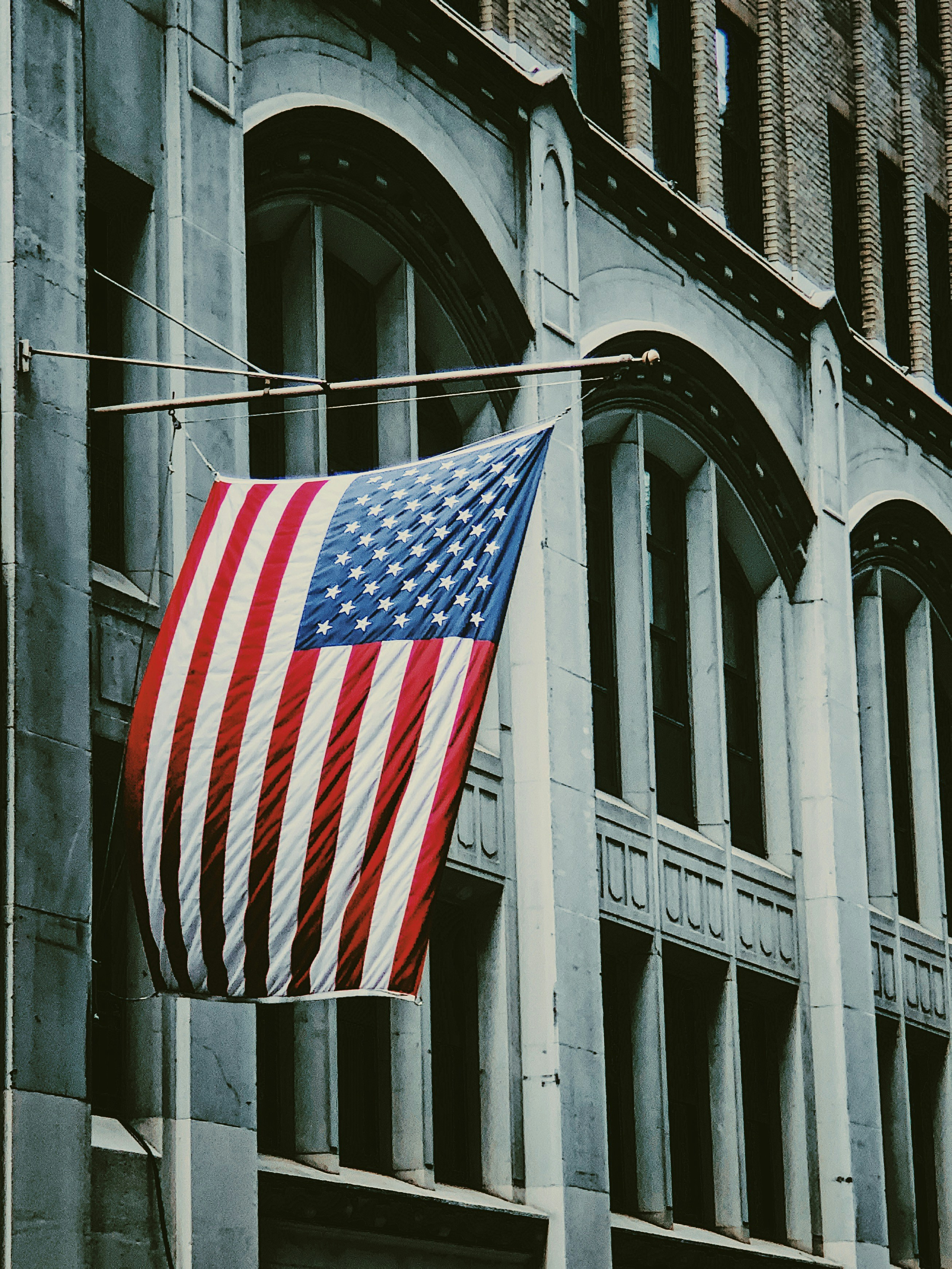 us a flag on gray concrete building
