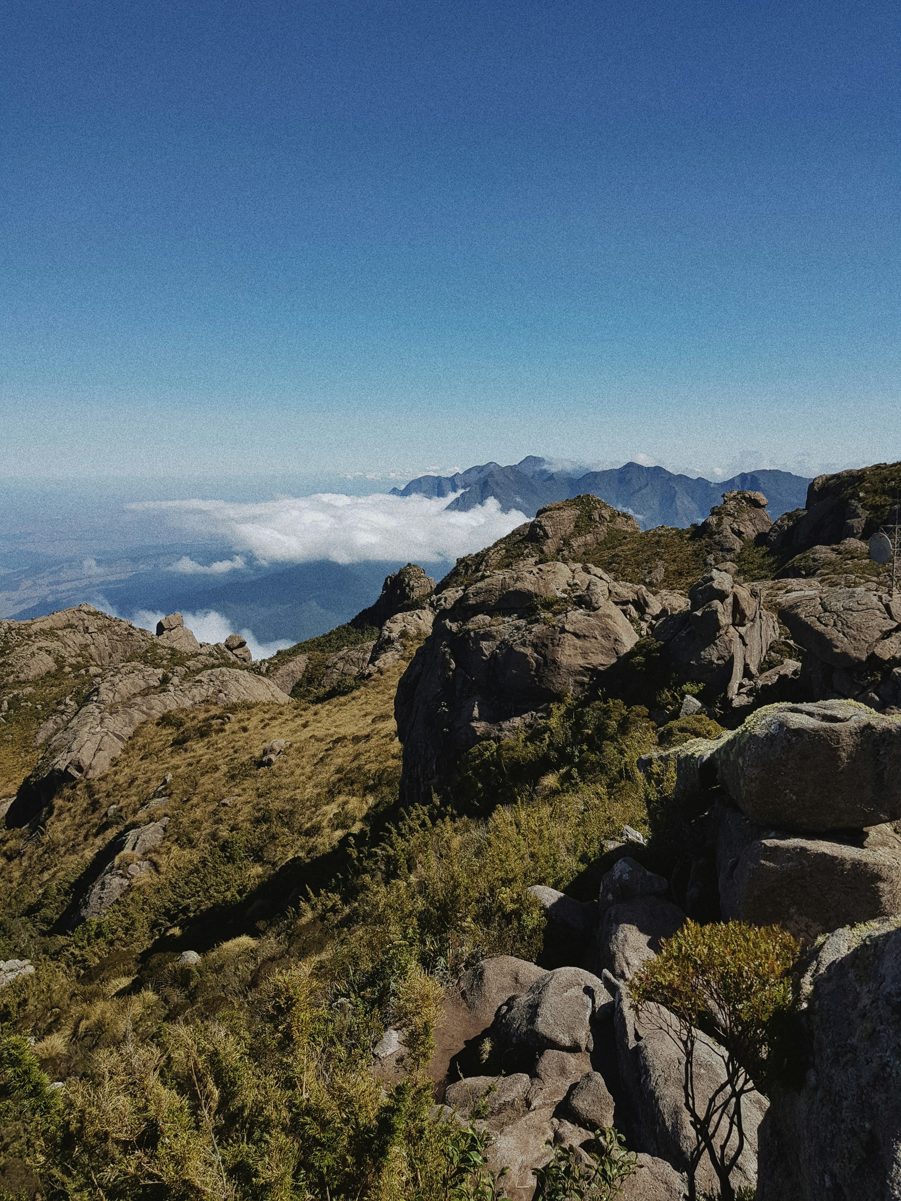 Rugged Ridge Above the Cloud Line at Distant Summit