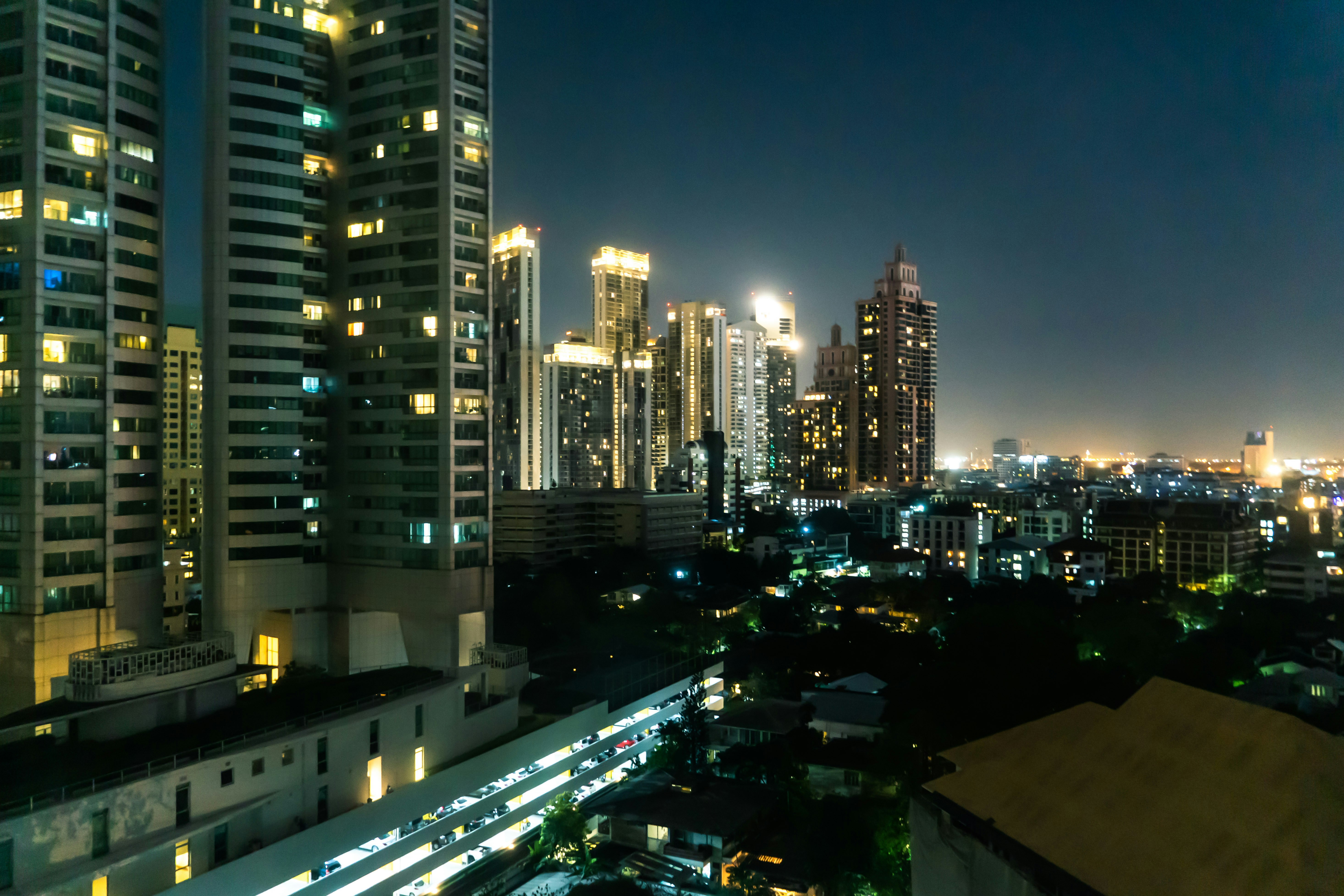 City with high rise buildings during night time photo – Free Building ...