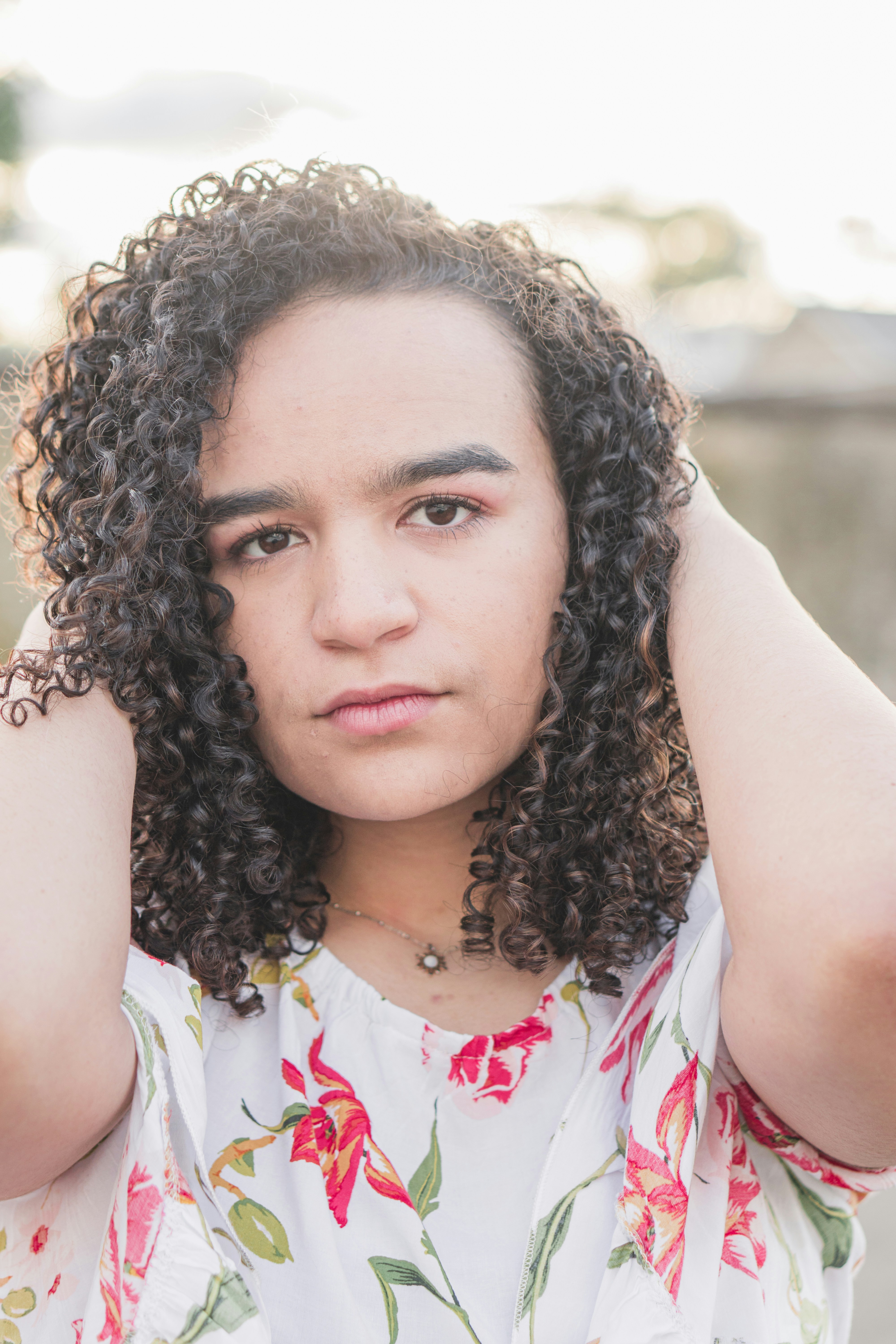 Sunlit Portrait with Floral Elegance