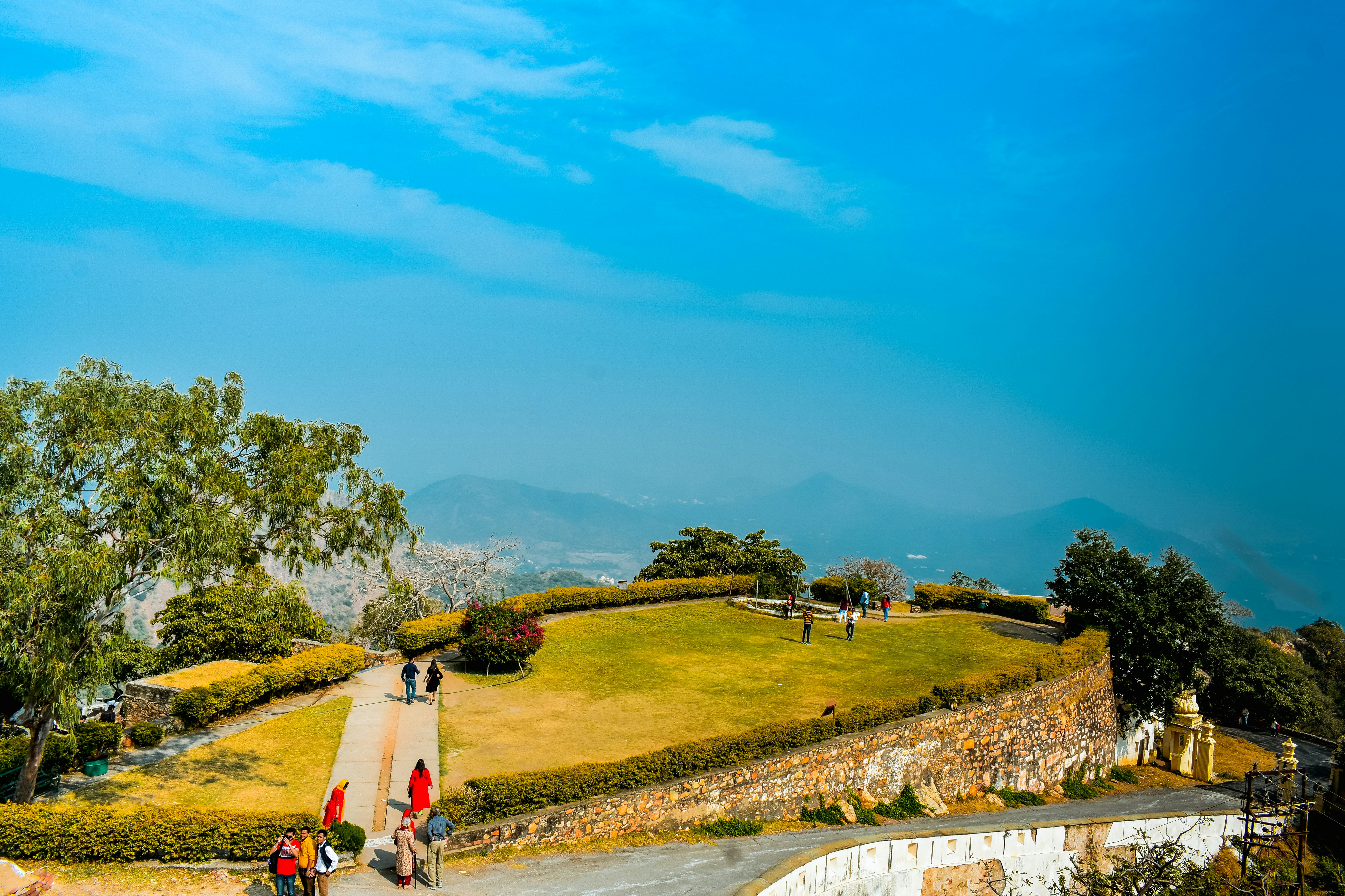 Circle Terrace at the Hilltop: Visitors Along a Blue Sky Vista