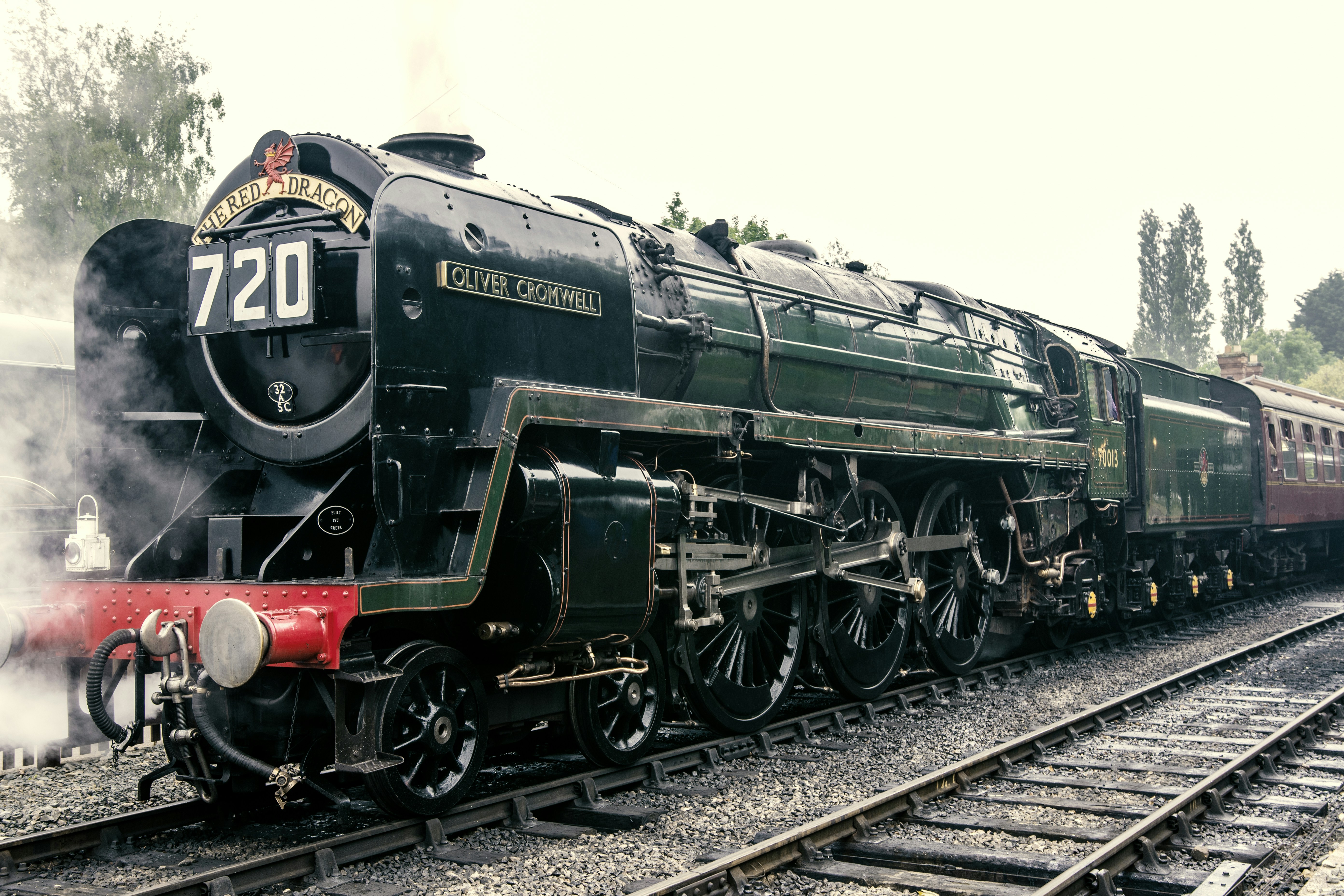 Black and red train on rail tracks during daytime photo – Free ...