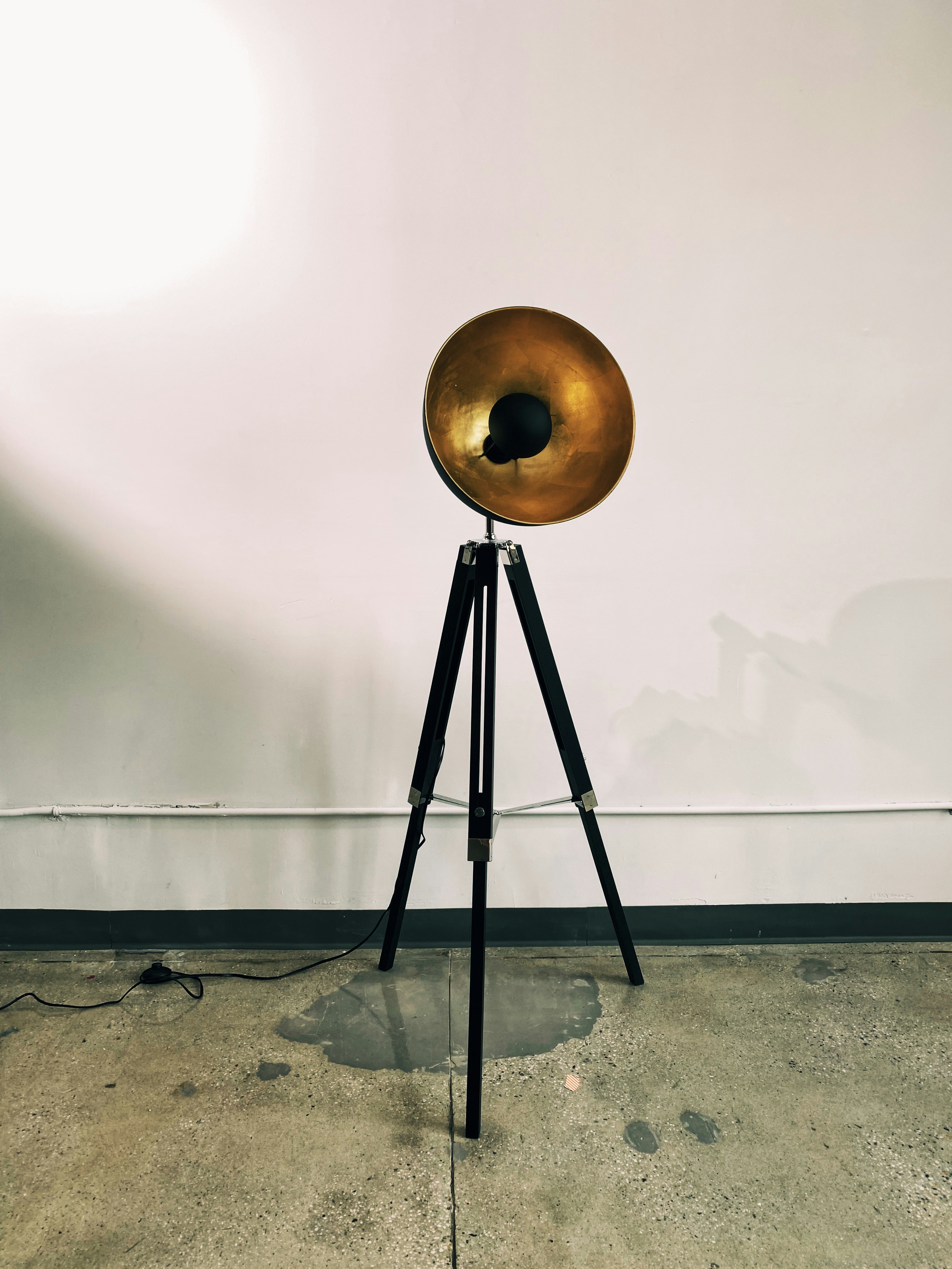 Studio Spotlight on a Lone Tripod Lamp