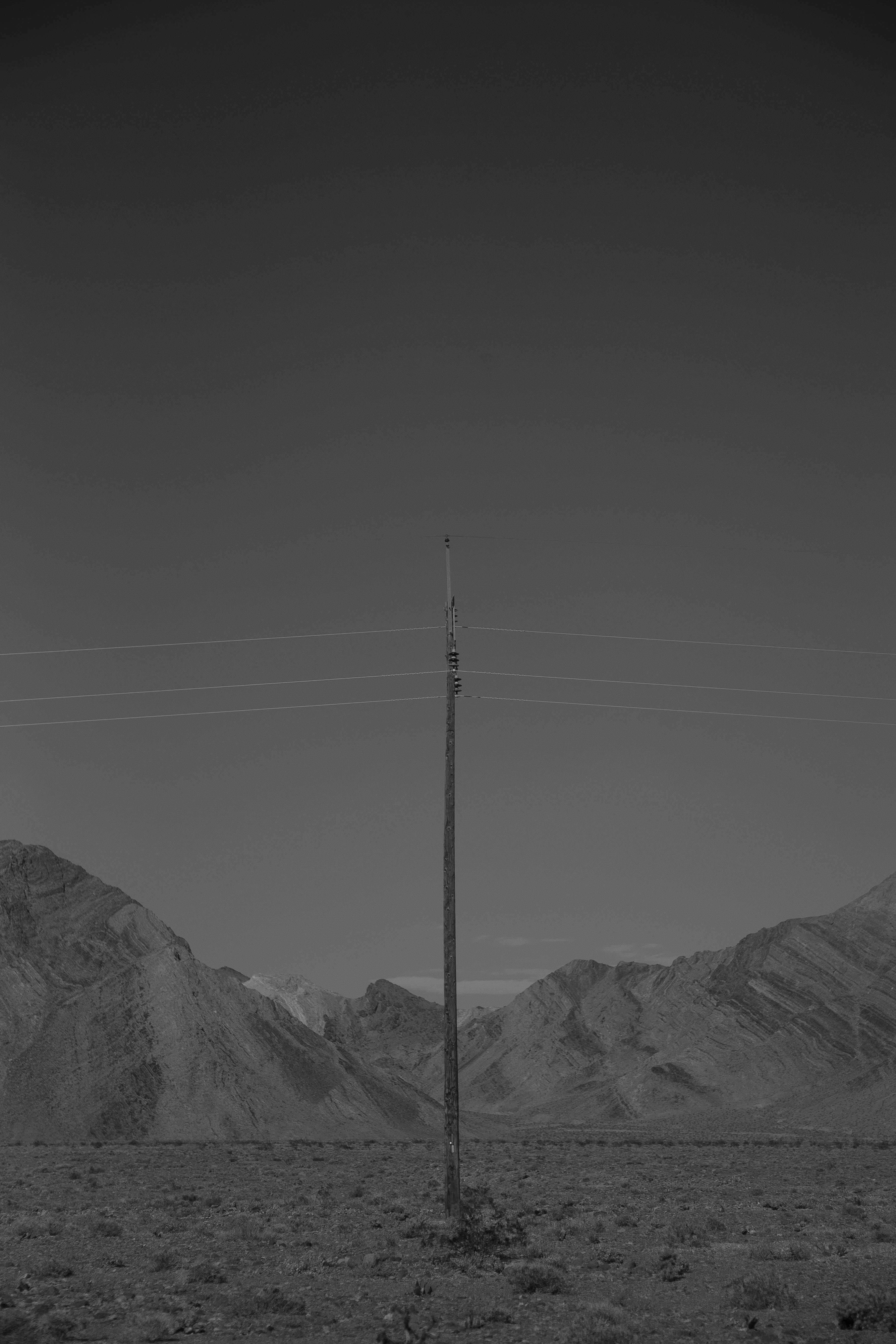 Grayscale photo of mountains and electric post photo – Free Phone ...