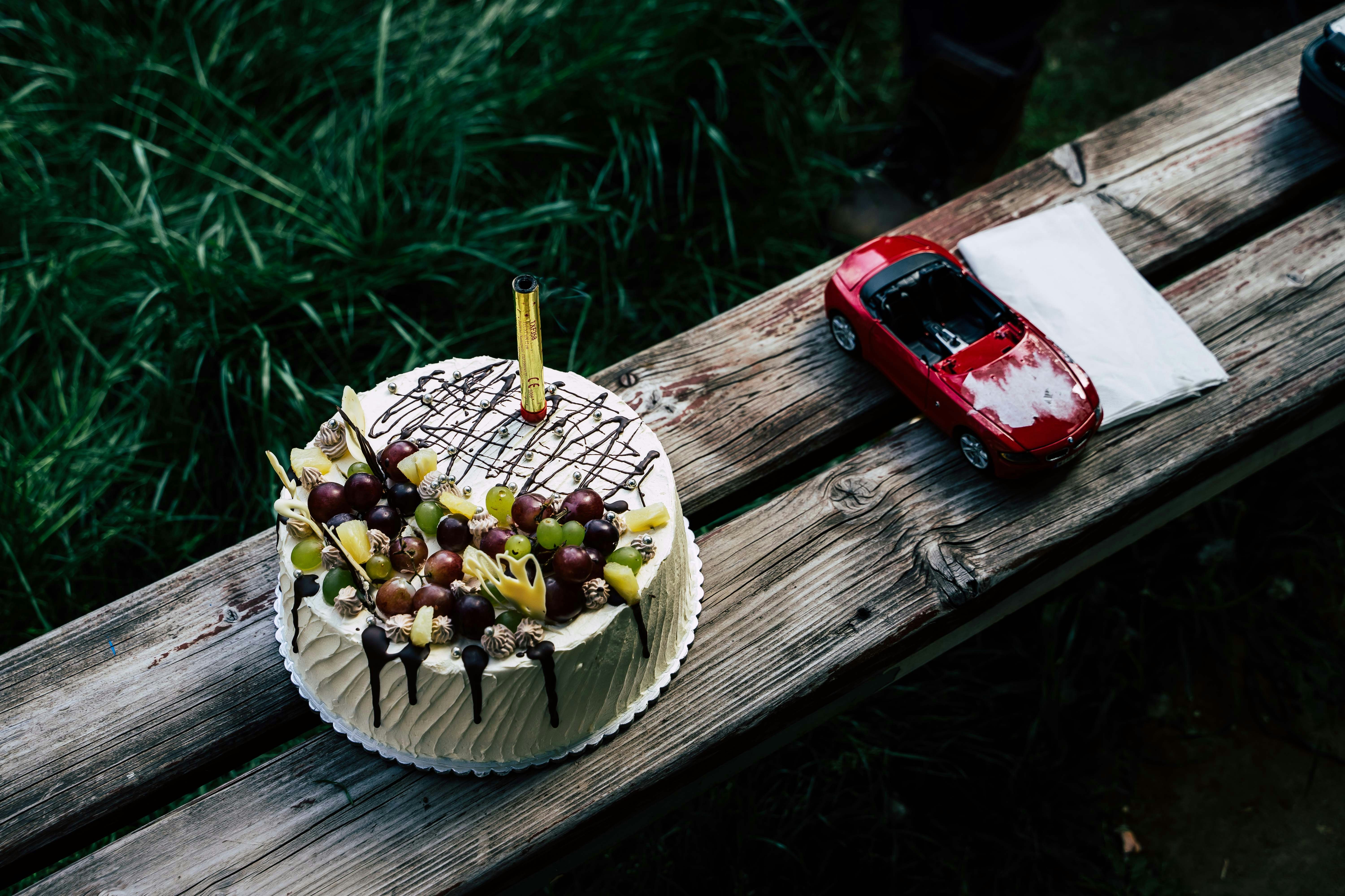 brown and white cake with white icing on brown wooden table
